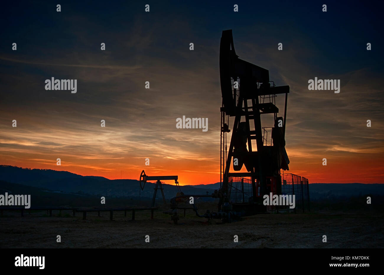 oil pump on orange sunset Stock Photo - Alamy
