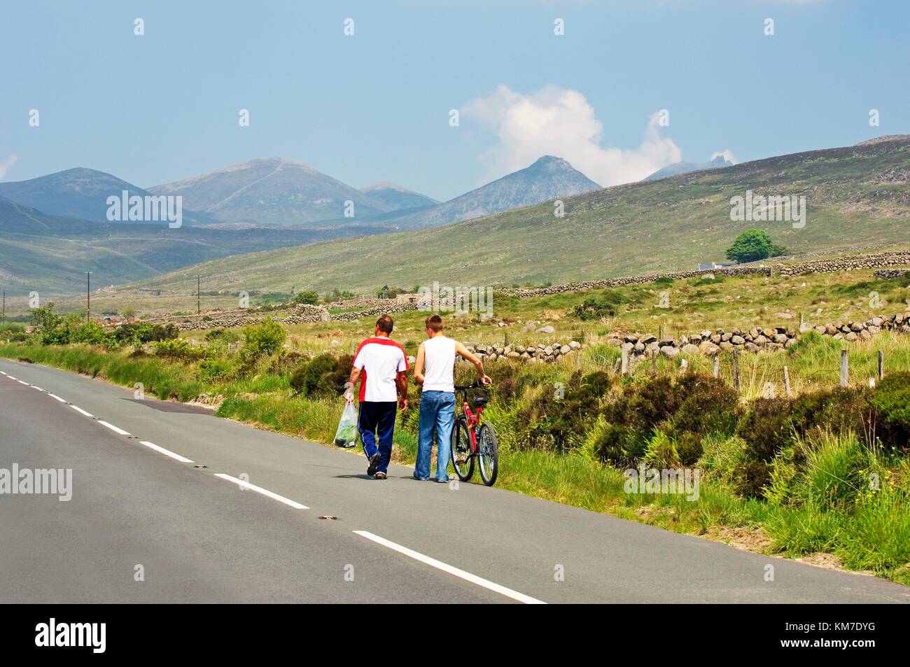 Two men walk the country road north from Attical in the southern Mourne ...