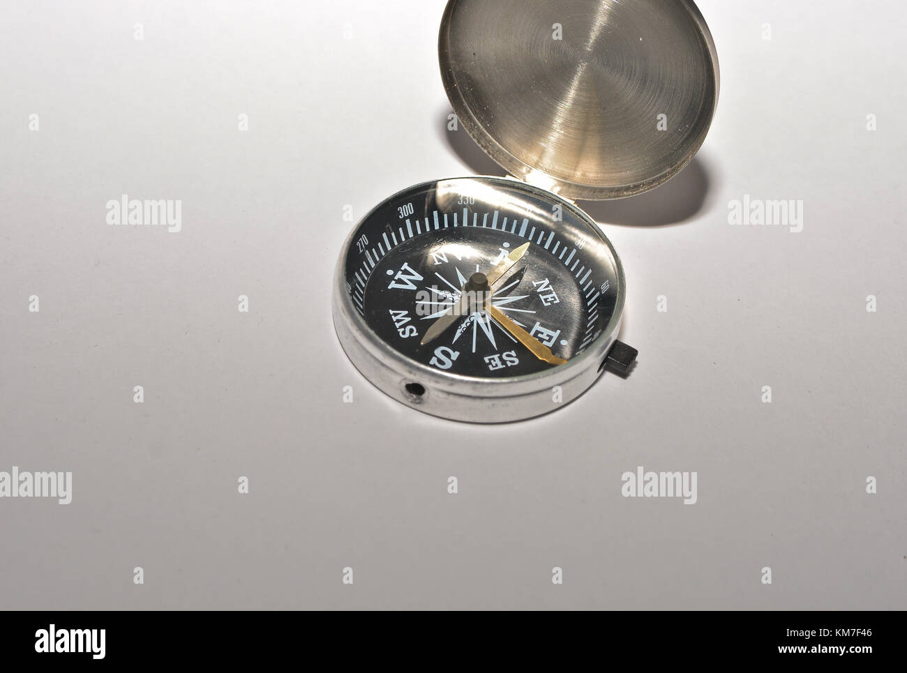 Compass on a white background. Photo of magnetic compass on white paper ...