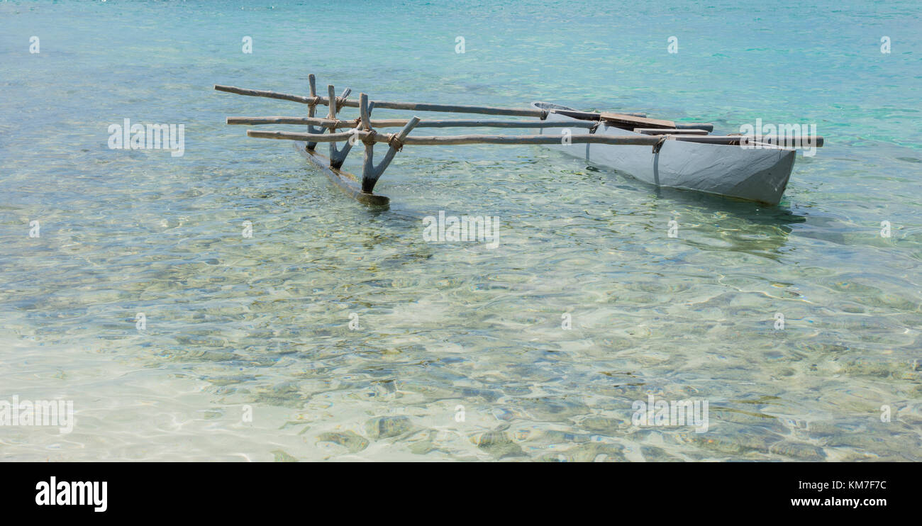 Outrigger canoe floating on the Pacific Ocean waters on the coast of ...