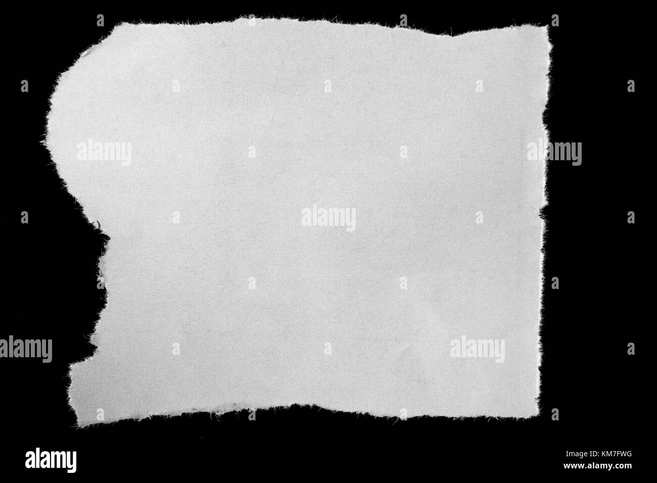 Piece of torn paper on black Stock Photo - Alamy