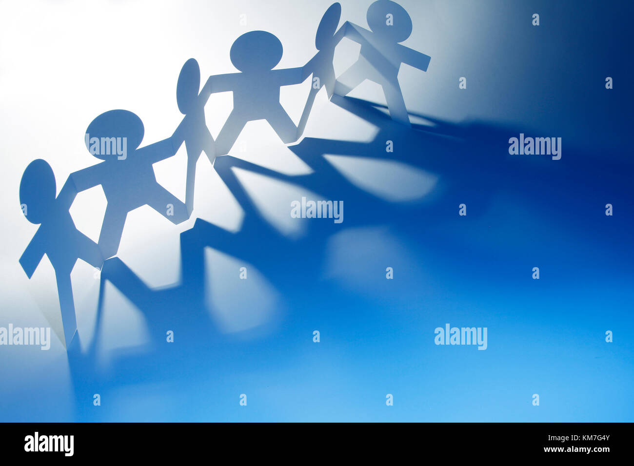 Team of paper chain people Stock Photo - Alamy