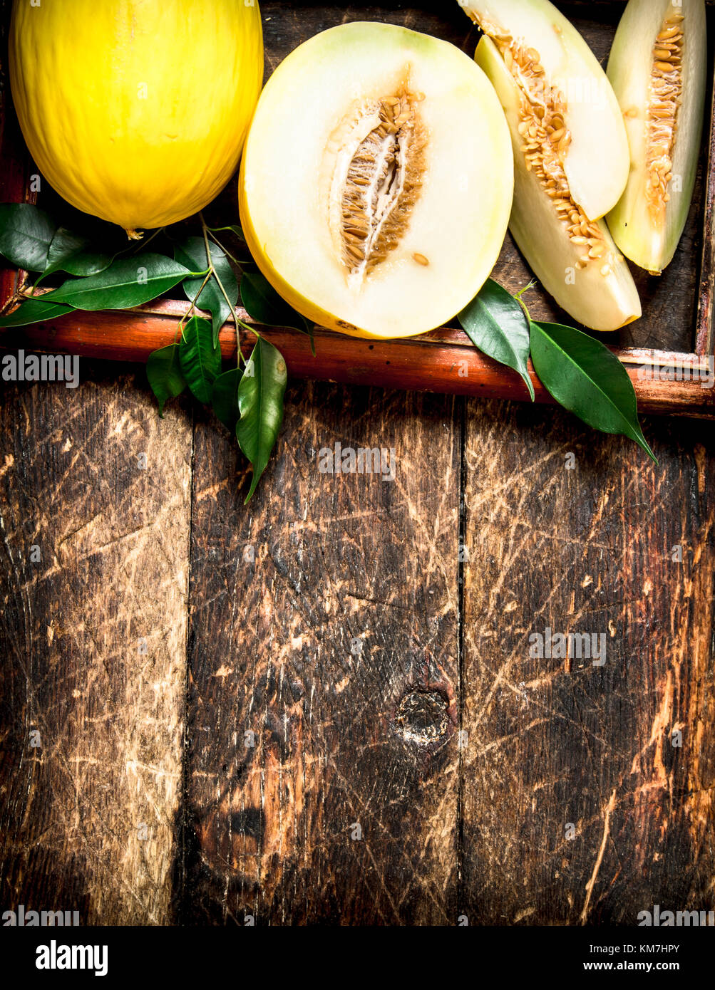 Fresh, fragrant melon. On the wooden background Stock Photo - Alamy