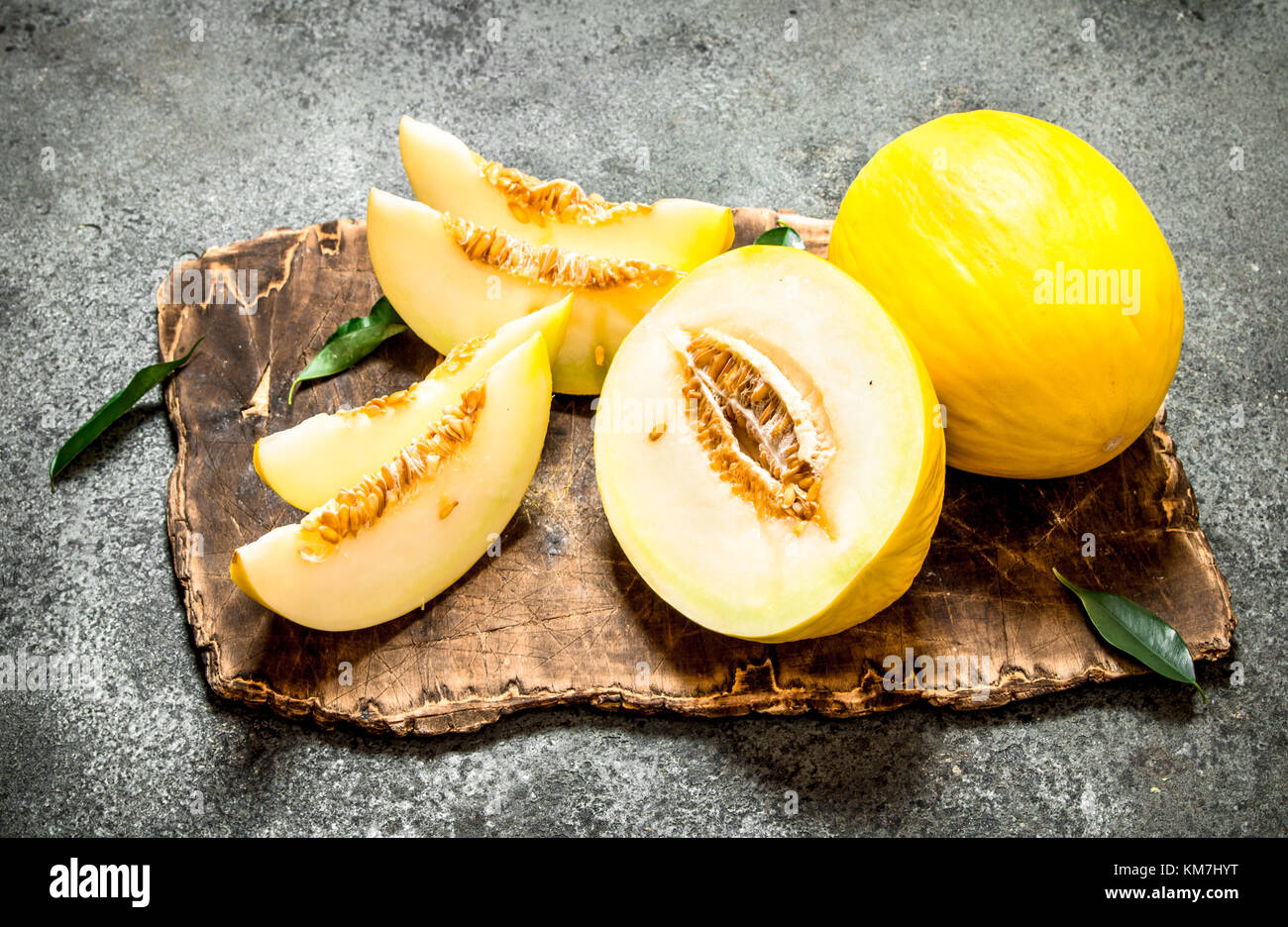 Ripe fresh melon . On the rustic background Stock Photo - Alamy