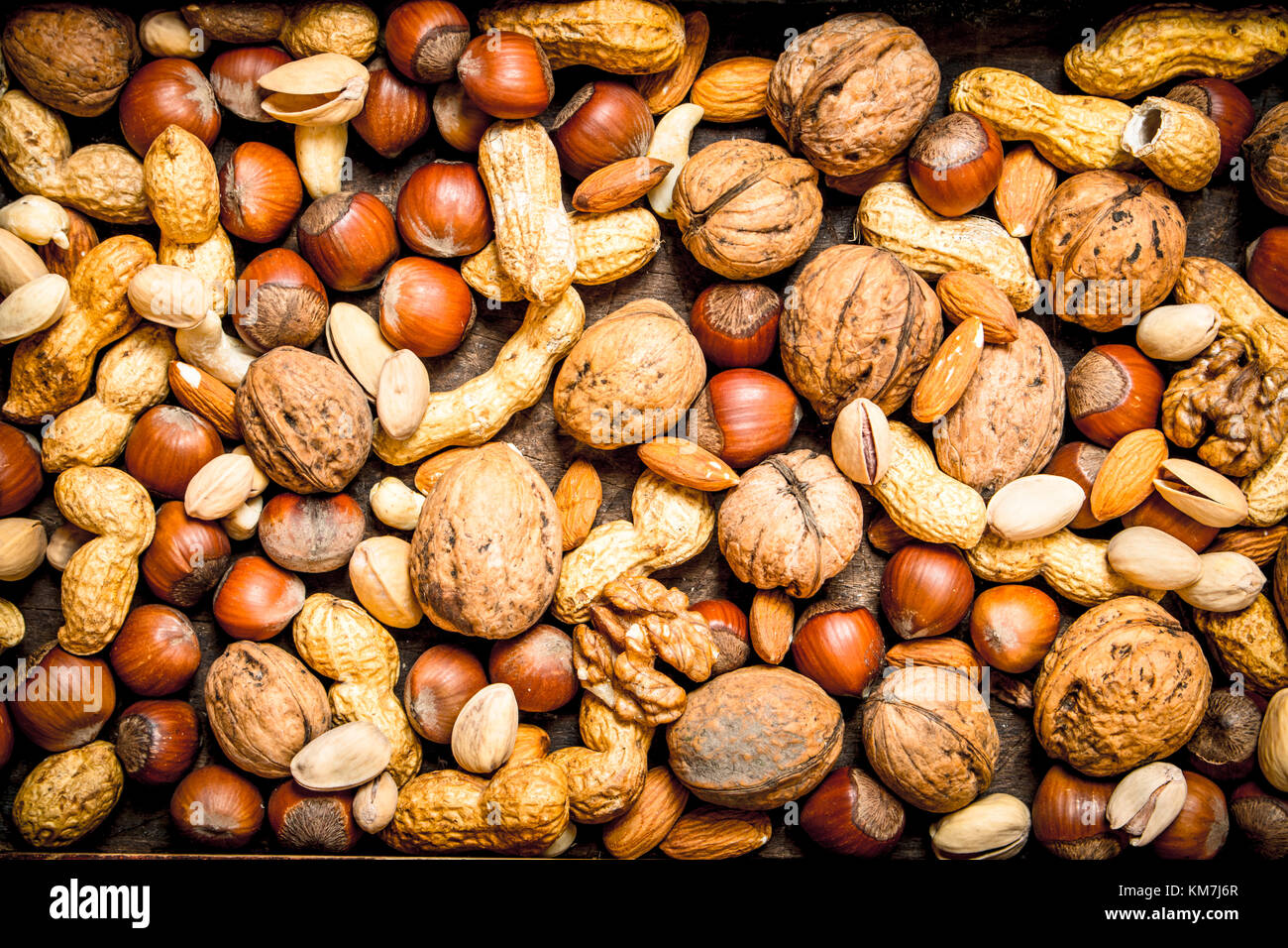 Different nuts - hazelnut, walnut, peanut. Top view Stock Photo - Alamy
