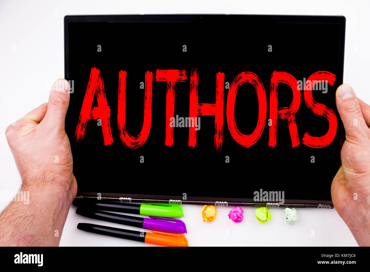 Authors text written on tablet, computer in the office with marker, pen ...