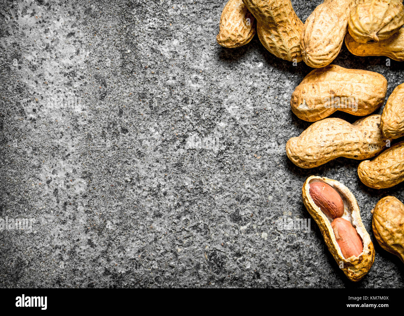 Peanuts in the shell. On rustic background Stock Photo - Alamy