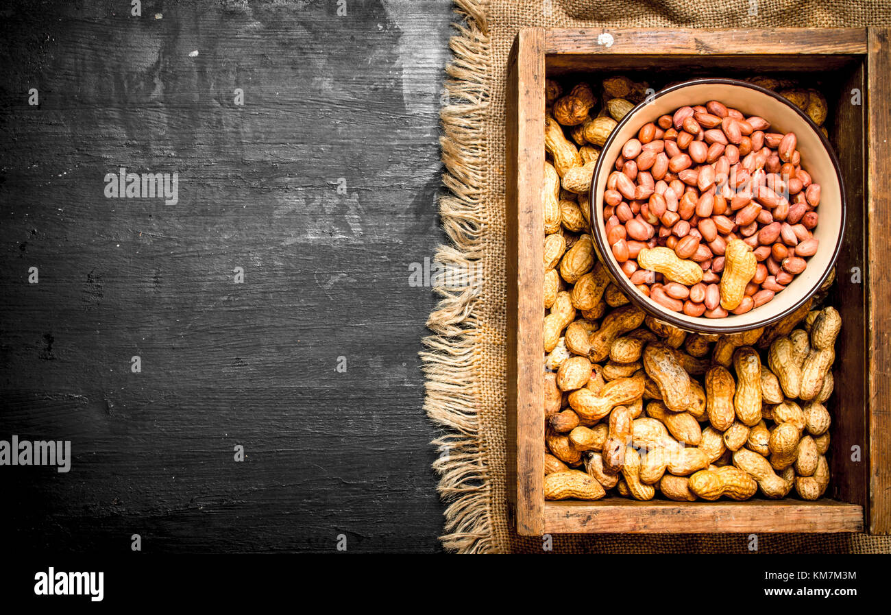 box of peanuts. On a black chalkboard Stock Photo - Alamy
