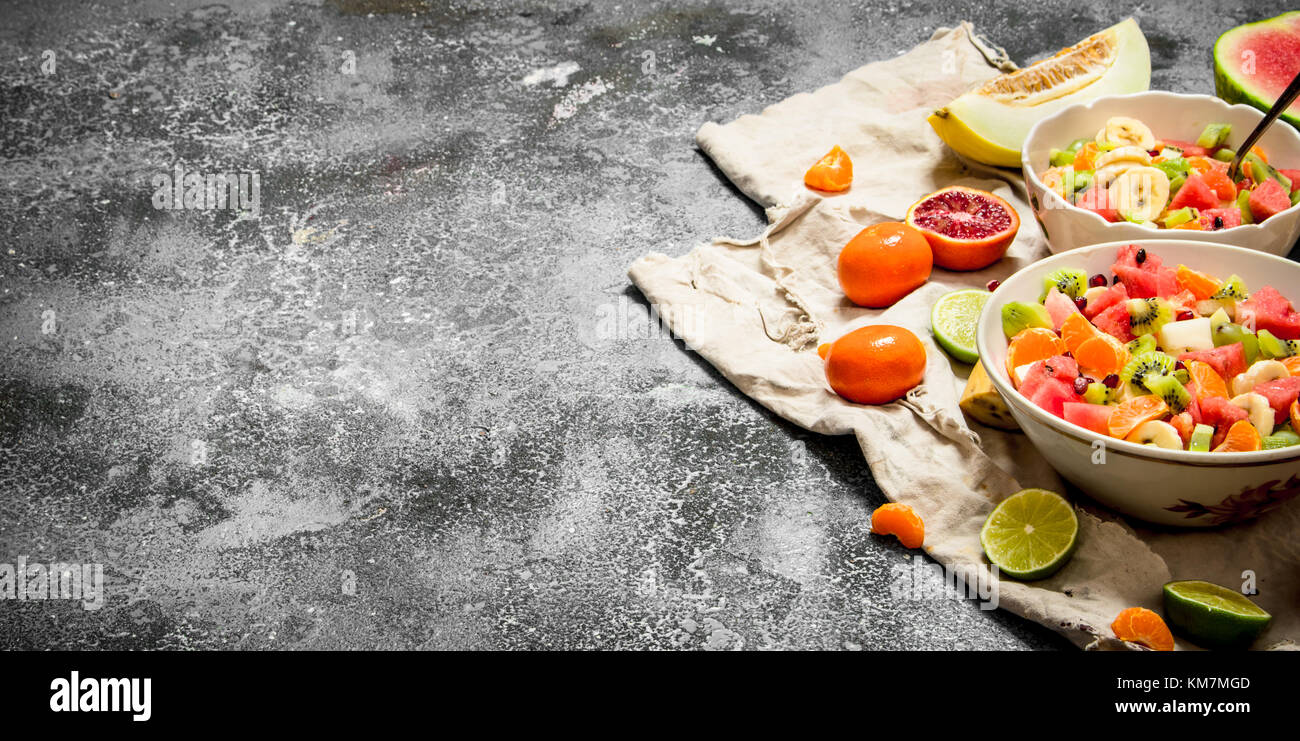 Tropical food . Tropical fruit salad. On rustic background Stock Photo ...