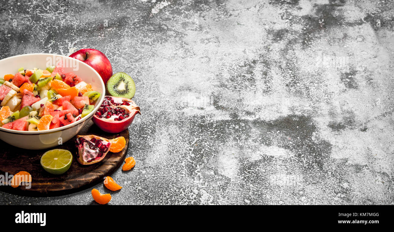 Tropical food . A tropical fruit salad. On rustic background Stock ...