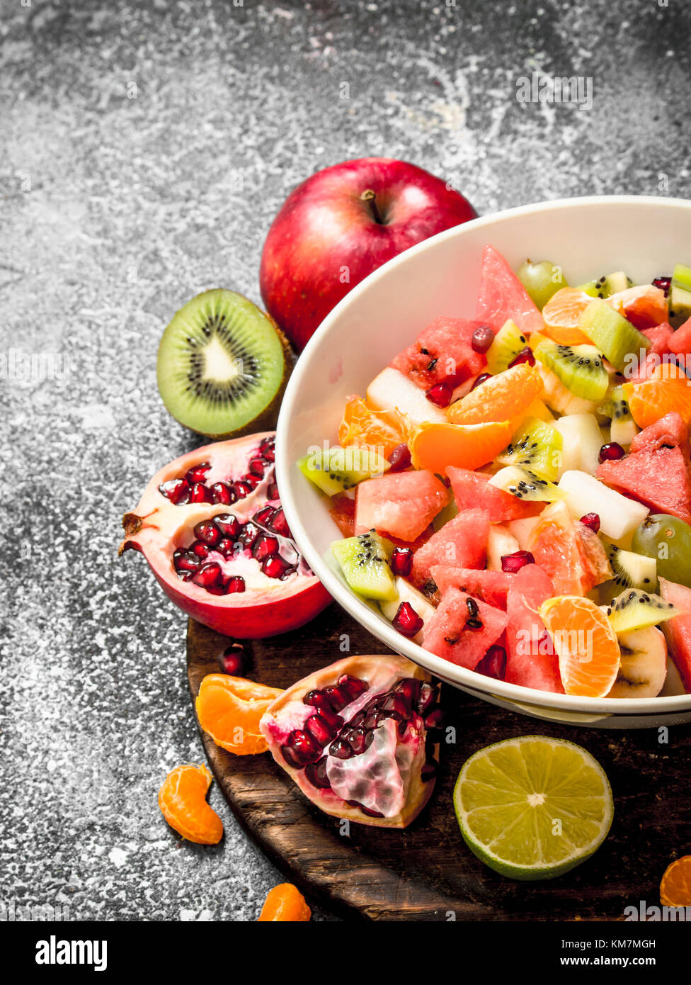 Tropical food . A tropical fruit salad. On rustic background Stock ...