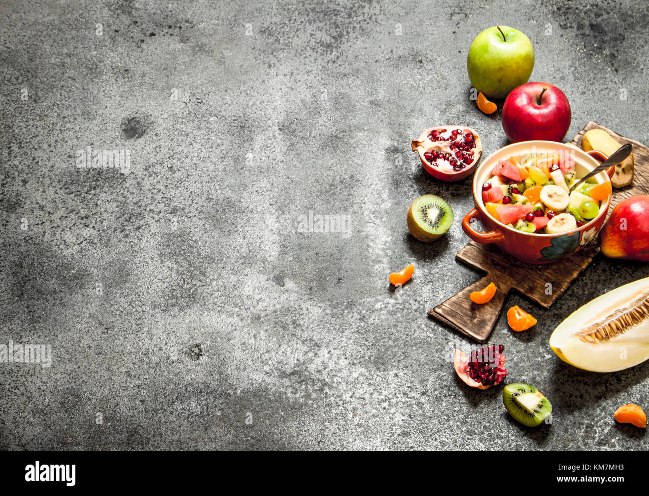 Tropical food . Tropical fruit salad. On rustic background Stock Photo ...