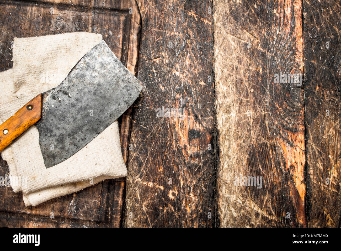 Serving background. Old hatchet on a chopping Board. On a wooden table ...