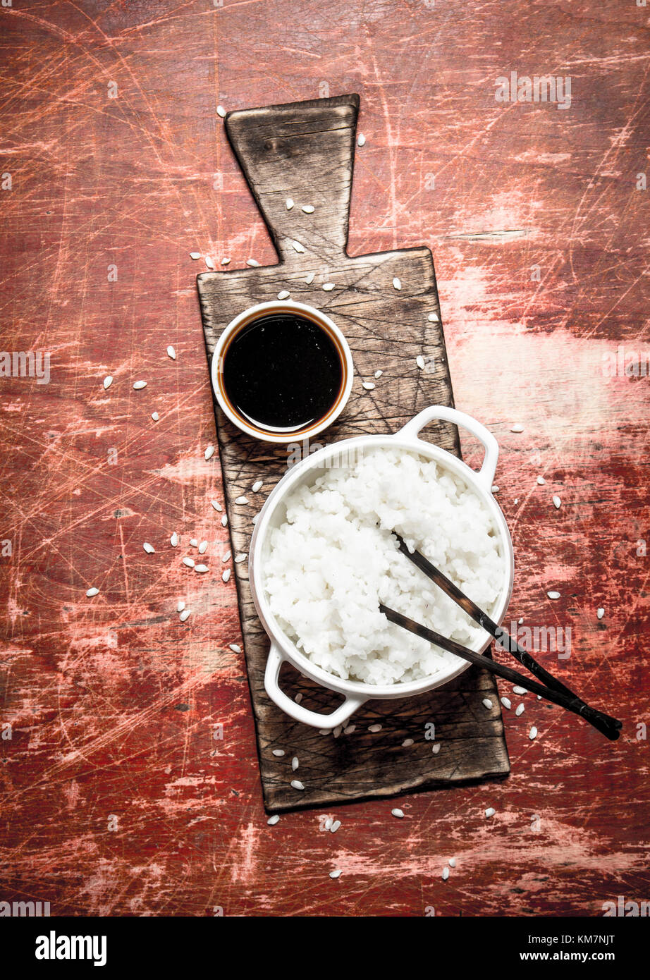 Asian food. Boiled rice with soy sauce Stock Photo - Alamy