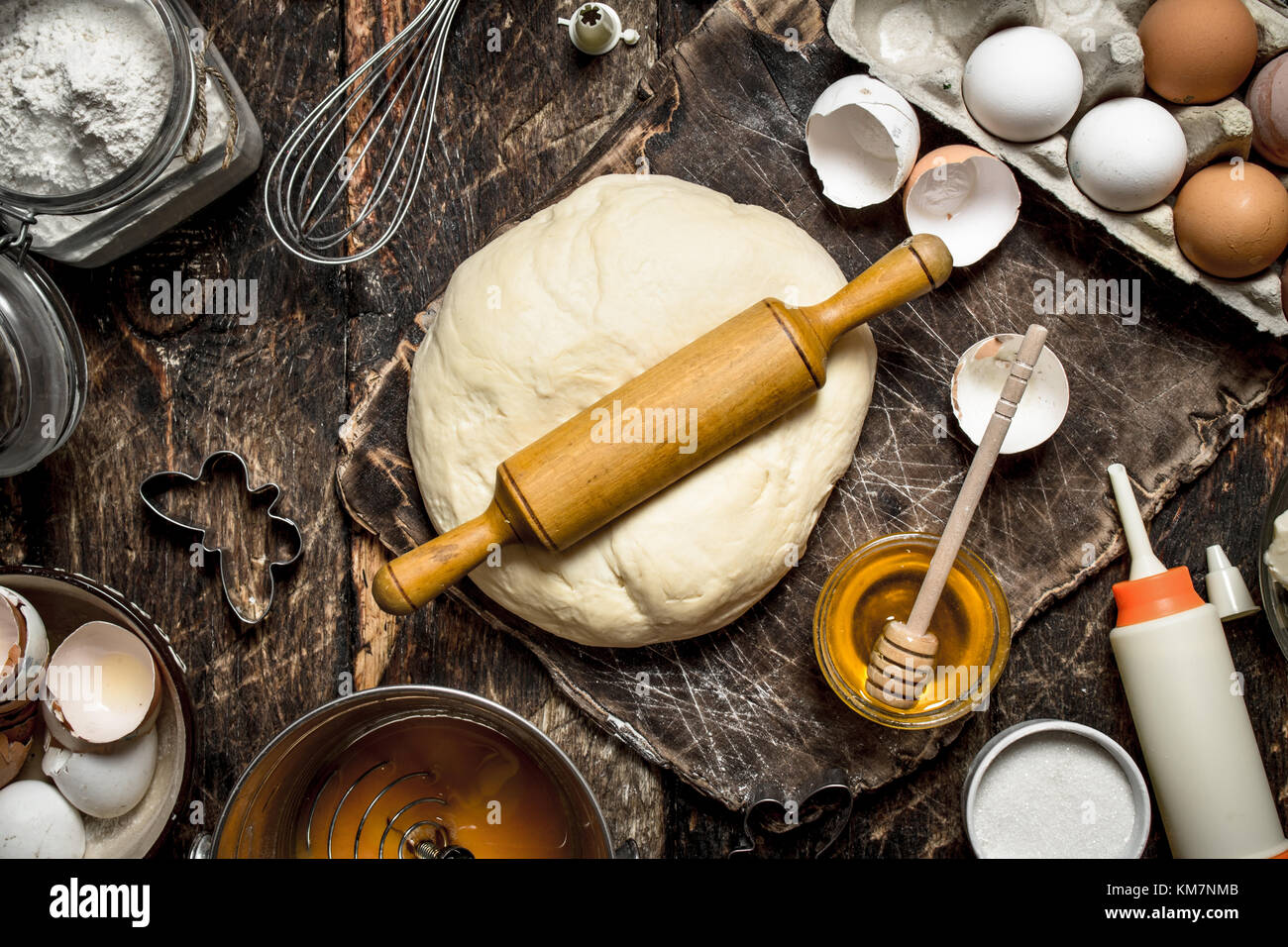 Dough background. Fresh dough with various ingredients on a wooden ...