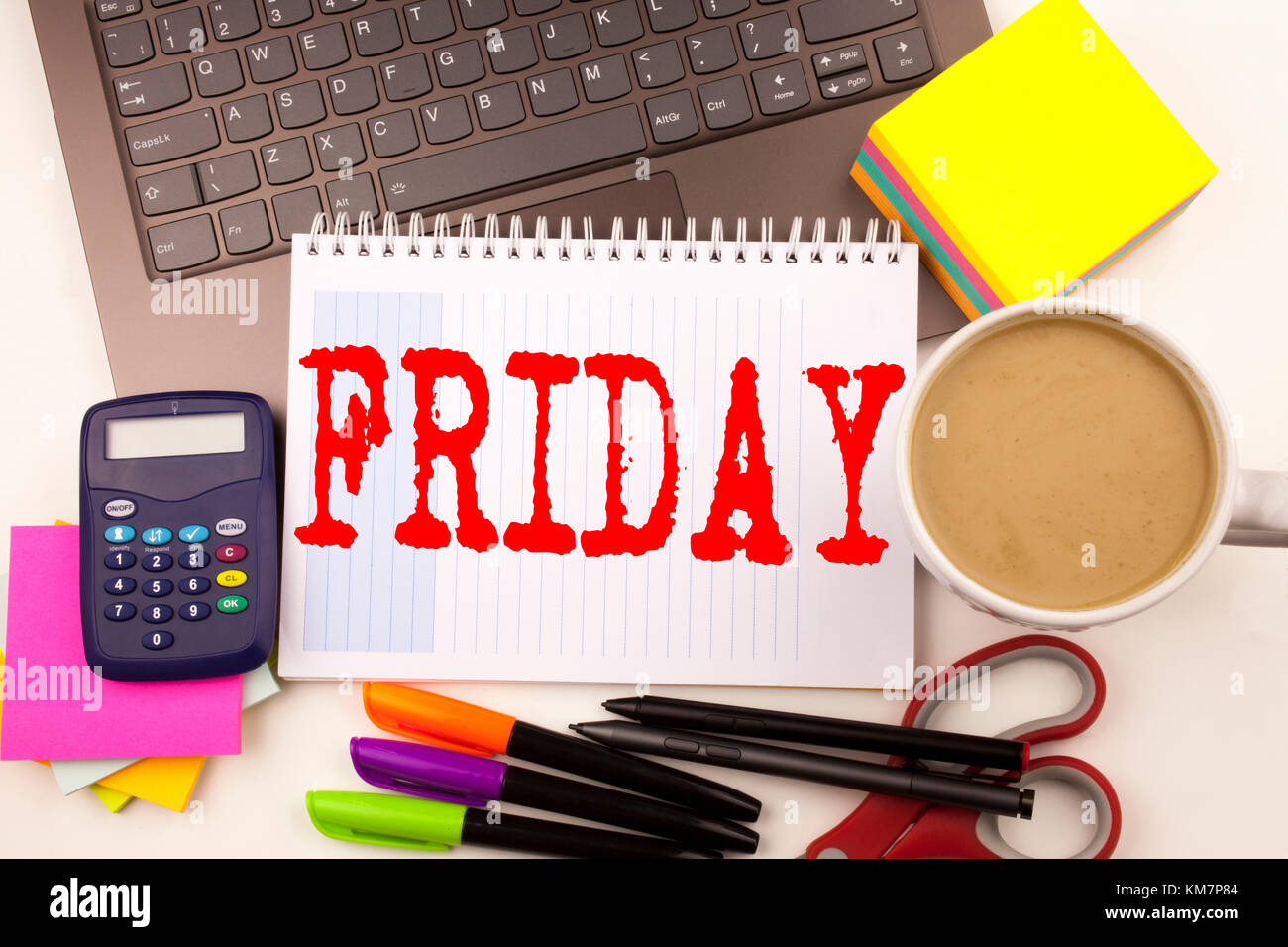 Word writing Friday in the office with laptop, marker, pen, stationery ...