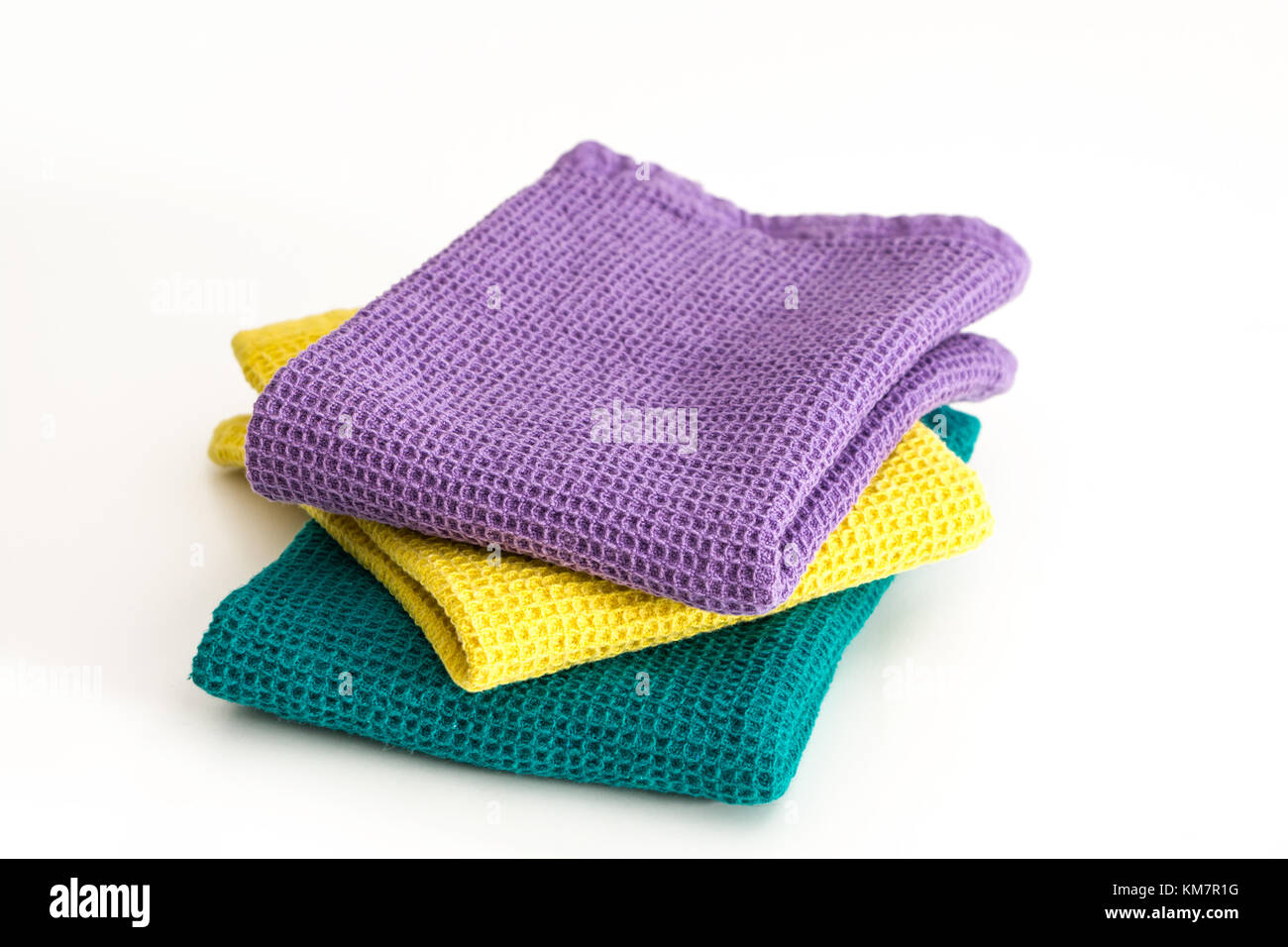 Stack of folded colorful kitchen towels, on white background Stock ...