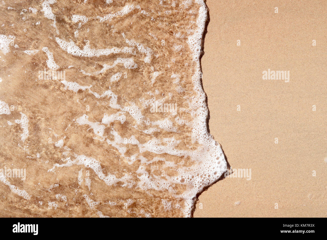 Transparent soft wave on sandy beach Stock Photo - Alamy