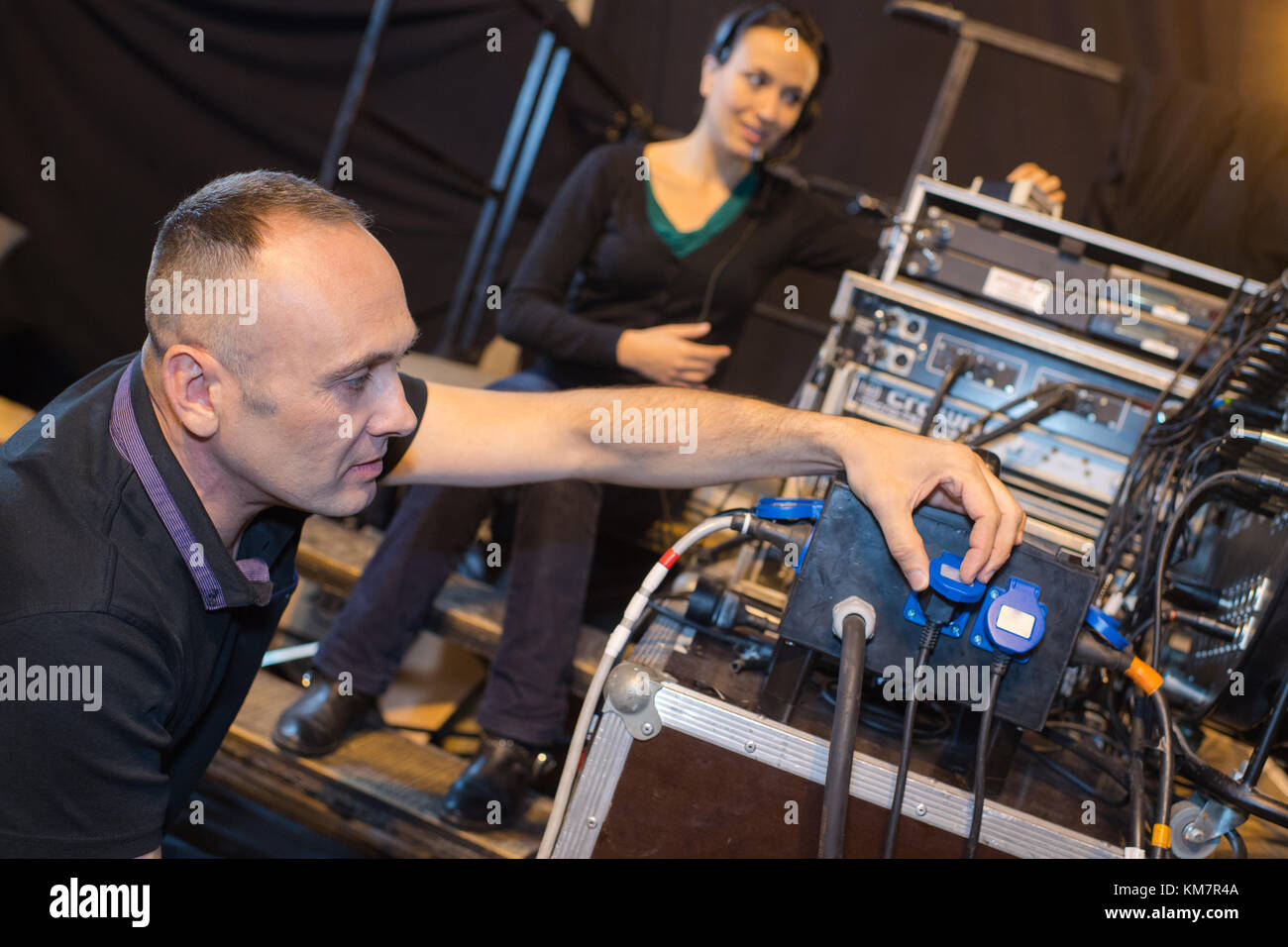 music producer working on digital studio mixer for tv programme Stock ...