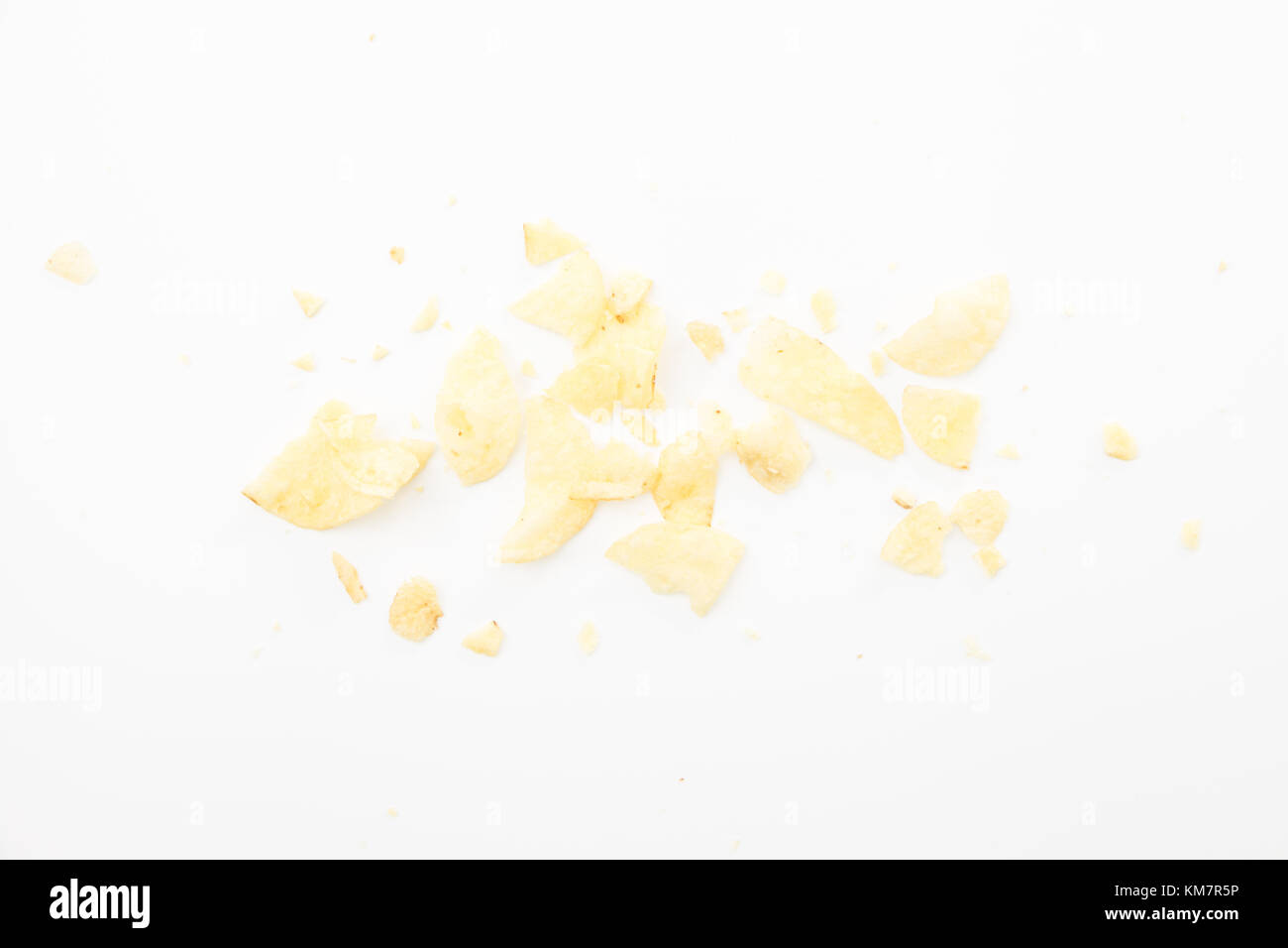 Crumbs of crispy potato chips, on white background Stock Photo - Alamy