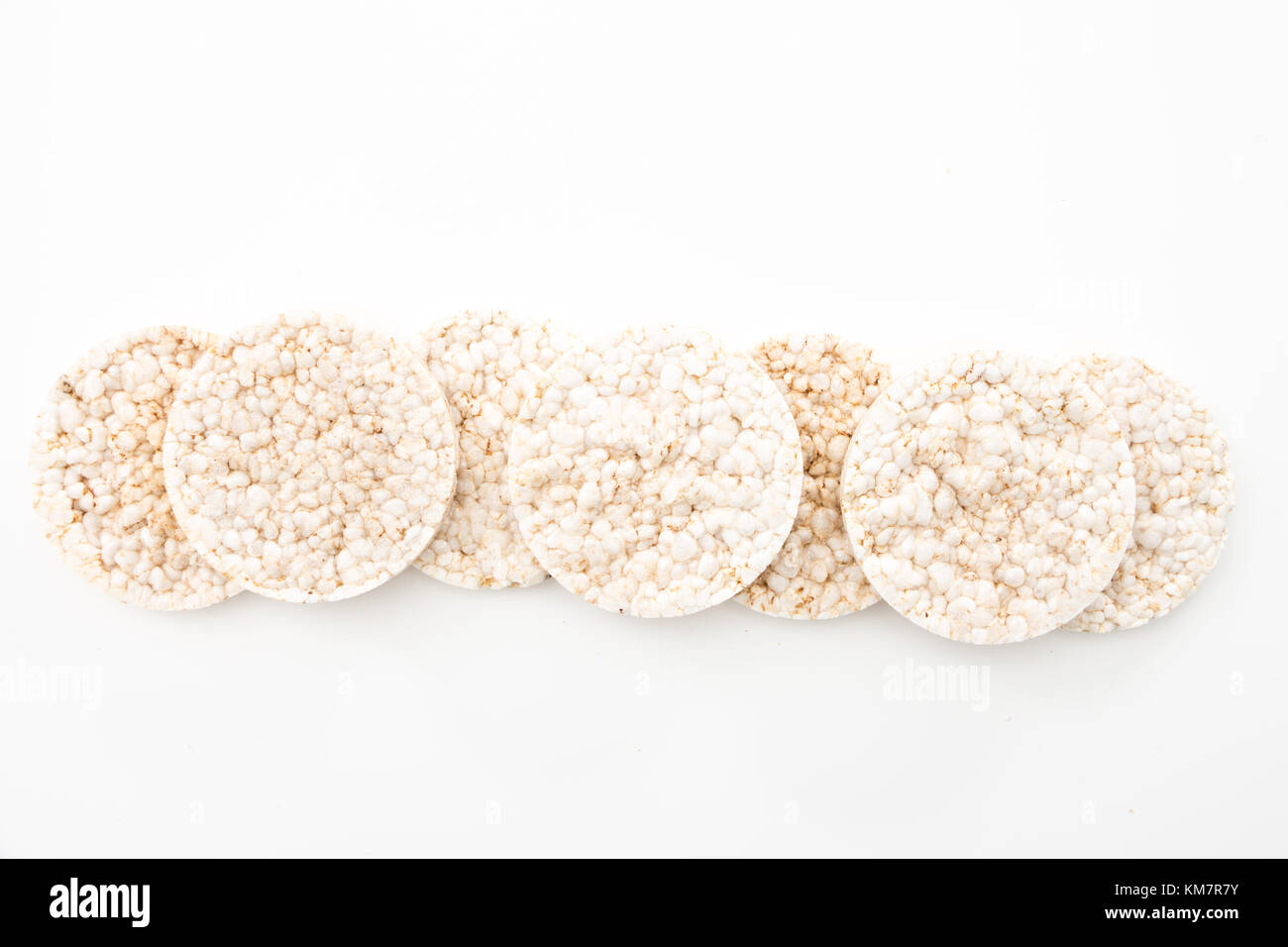 Round rice cakes/ crackers, on white background Stock Photo - Alamy