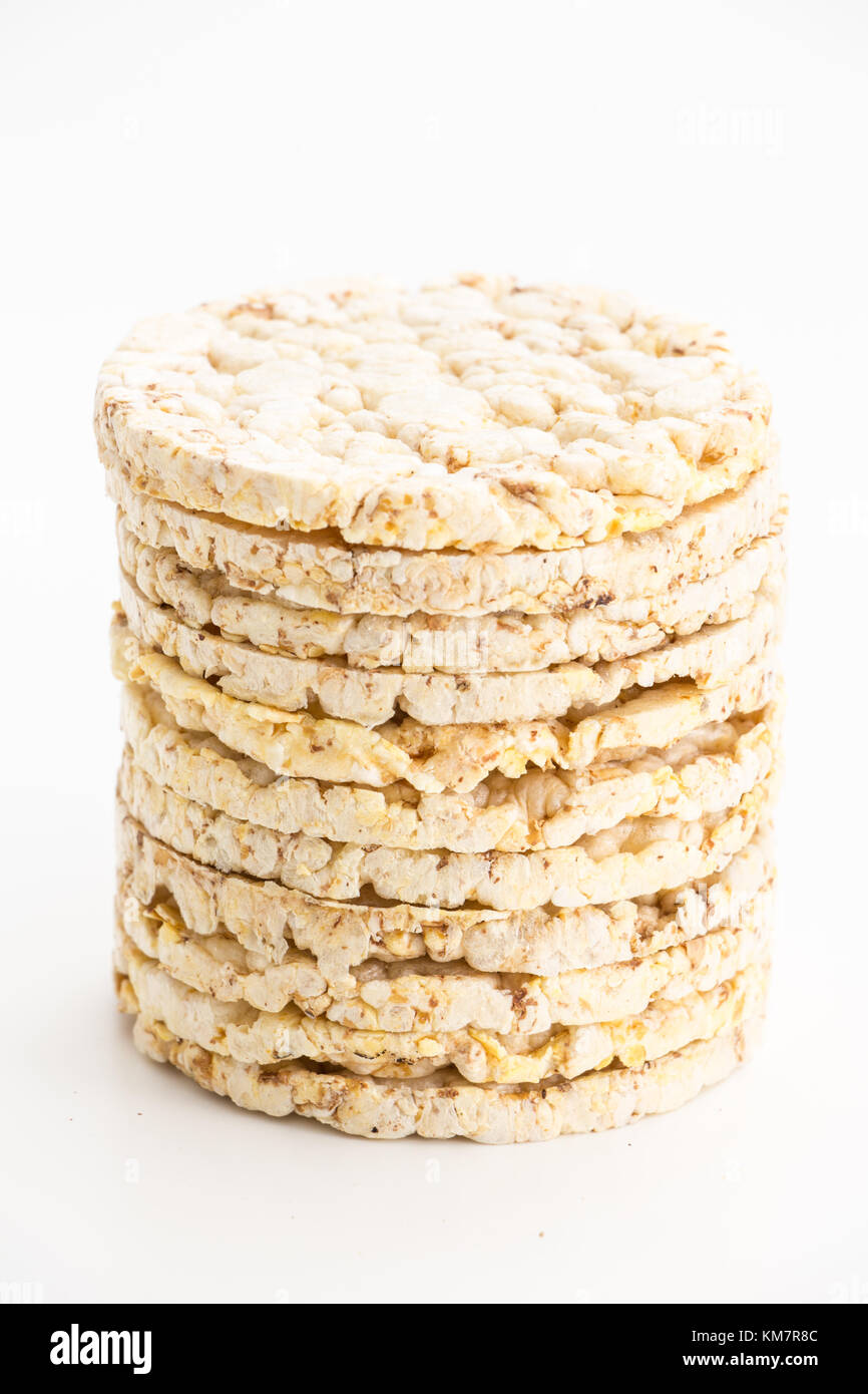 Round corn cakes/ crackers, on white background Stock Photo - Alamy