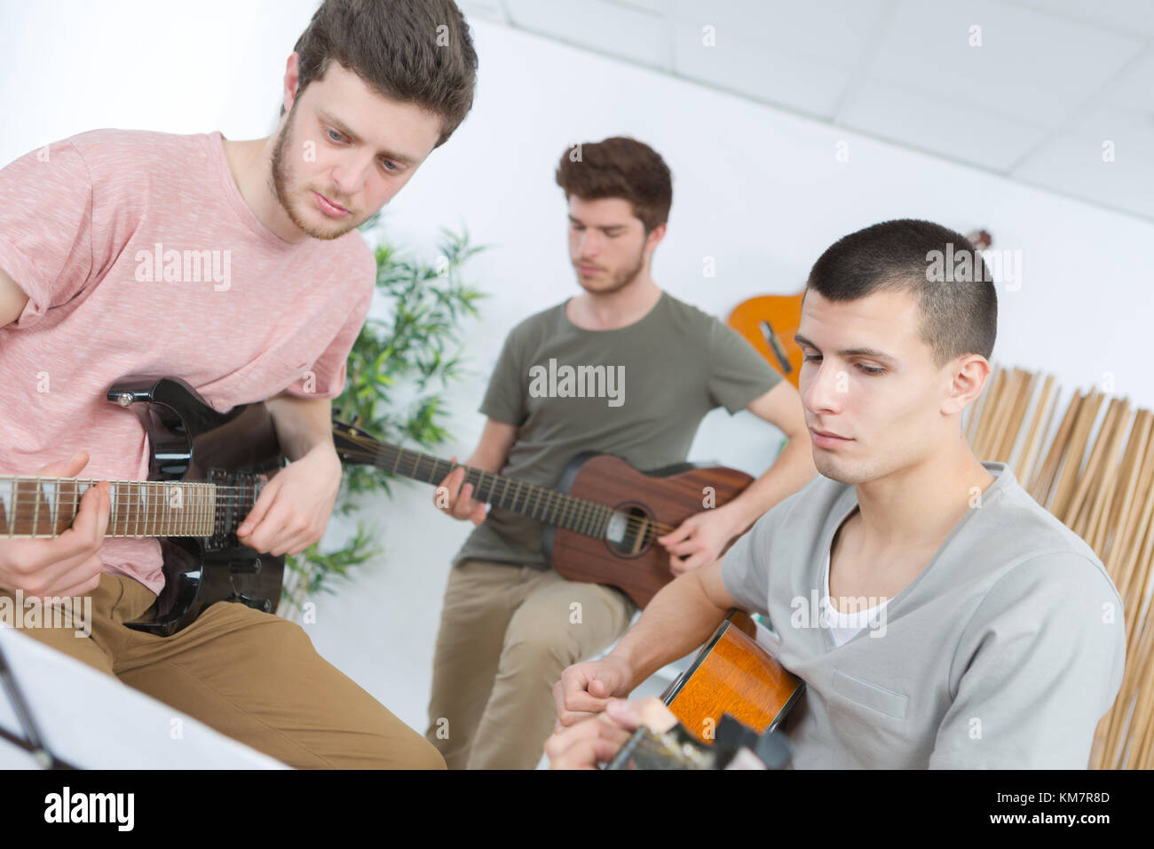 friends playing music Stock Photo - Alamy