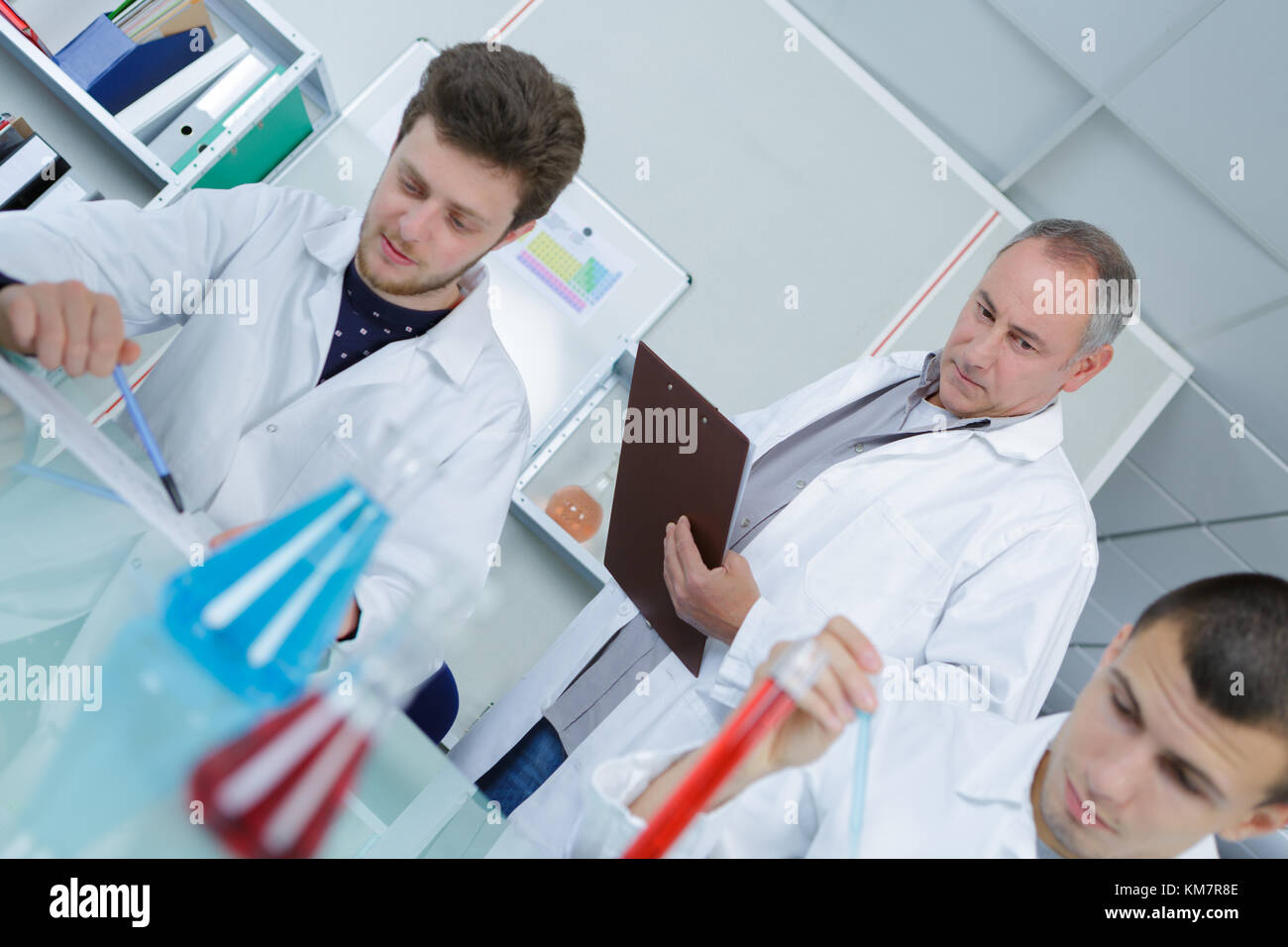 Male scientists in class Stock Photo - Alamy