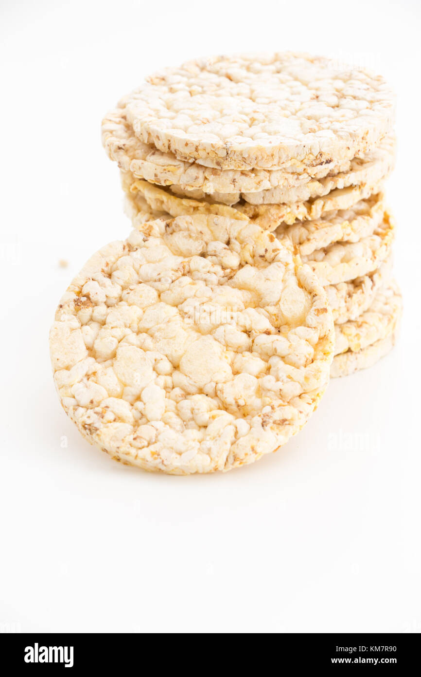 Round corn cakes/ crackers, on white background Stock Photo - Alamy