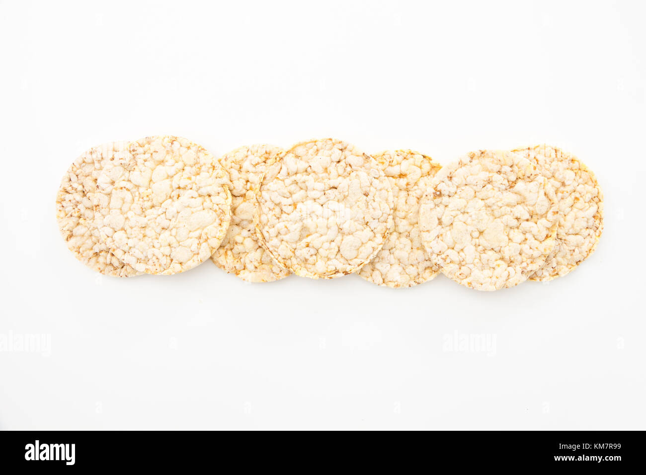 Round corn cakes/ crackers, on white background Stock Photo - Alamy