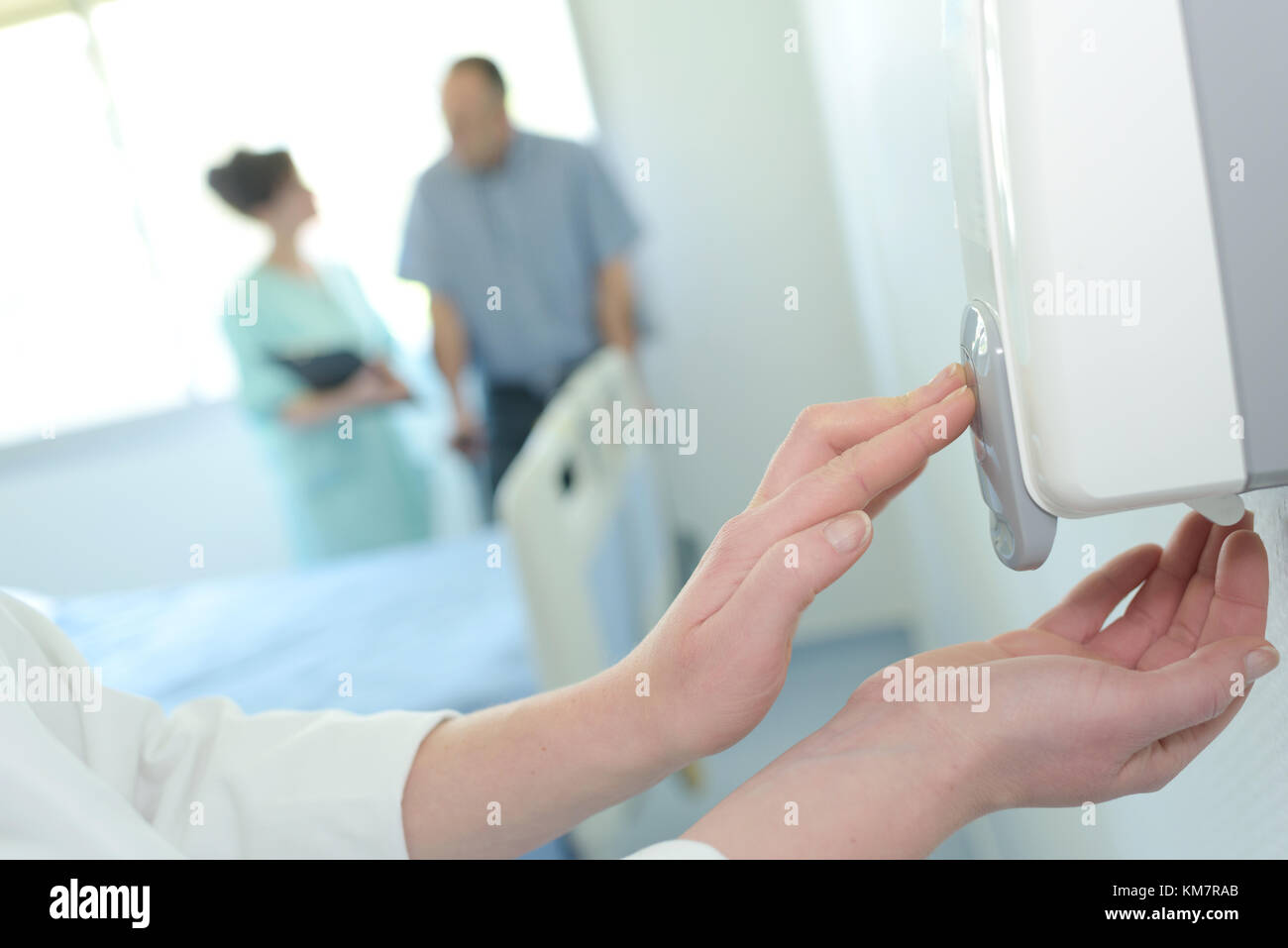 automatic dispenser hands Stock Photo - Alamy