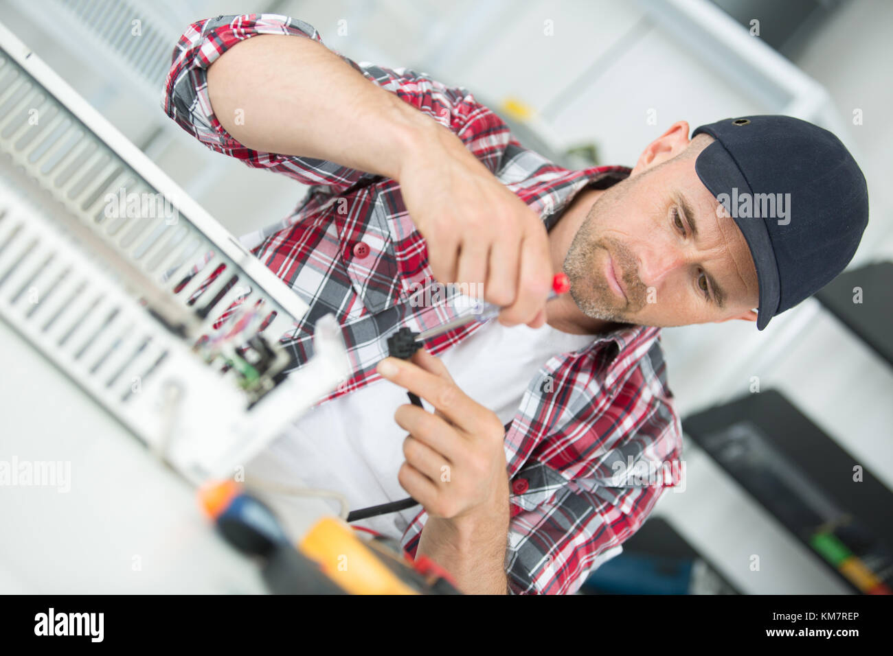 engineer repairs a device Stock Photo - Alamy