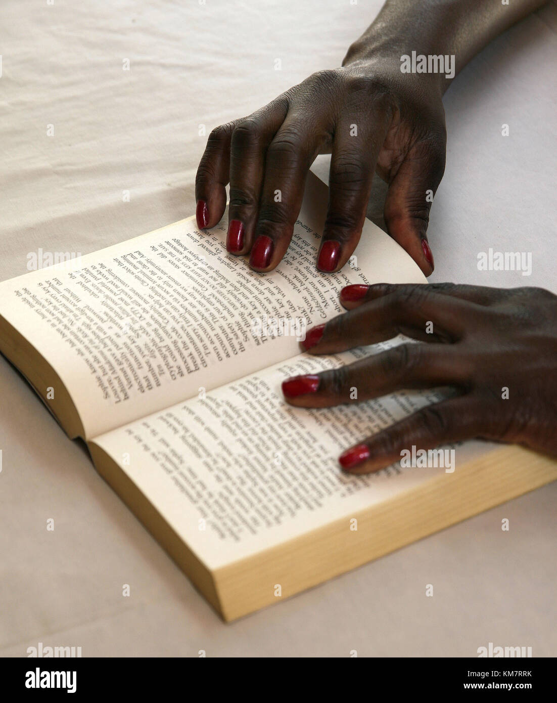 African woman reading a book Stock Photo - Alamy