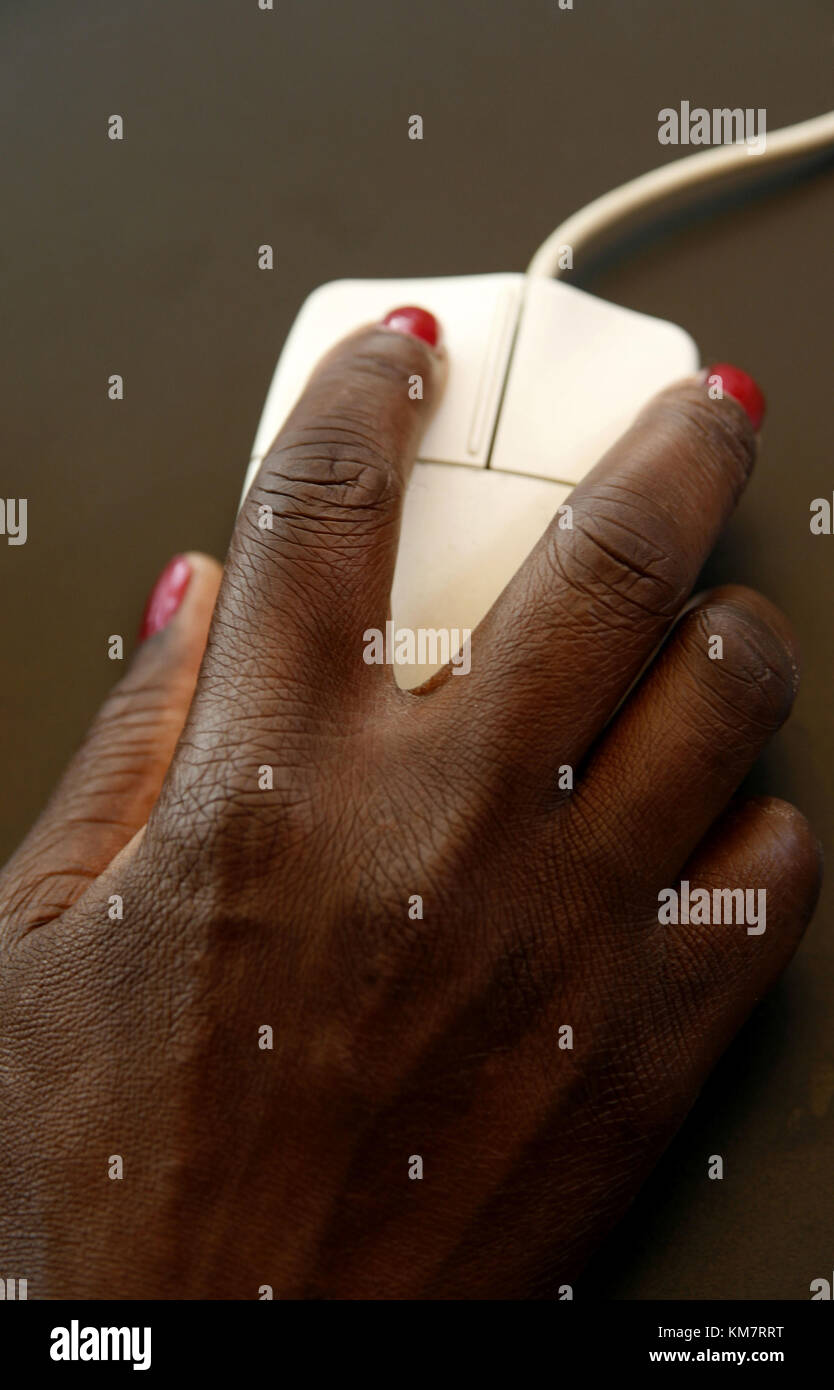 African woman using a computer mouse Stock Photo - Alamy