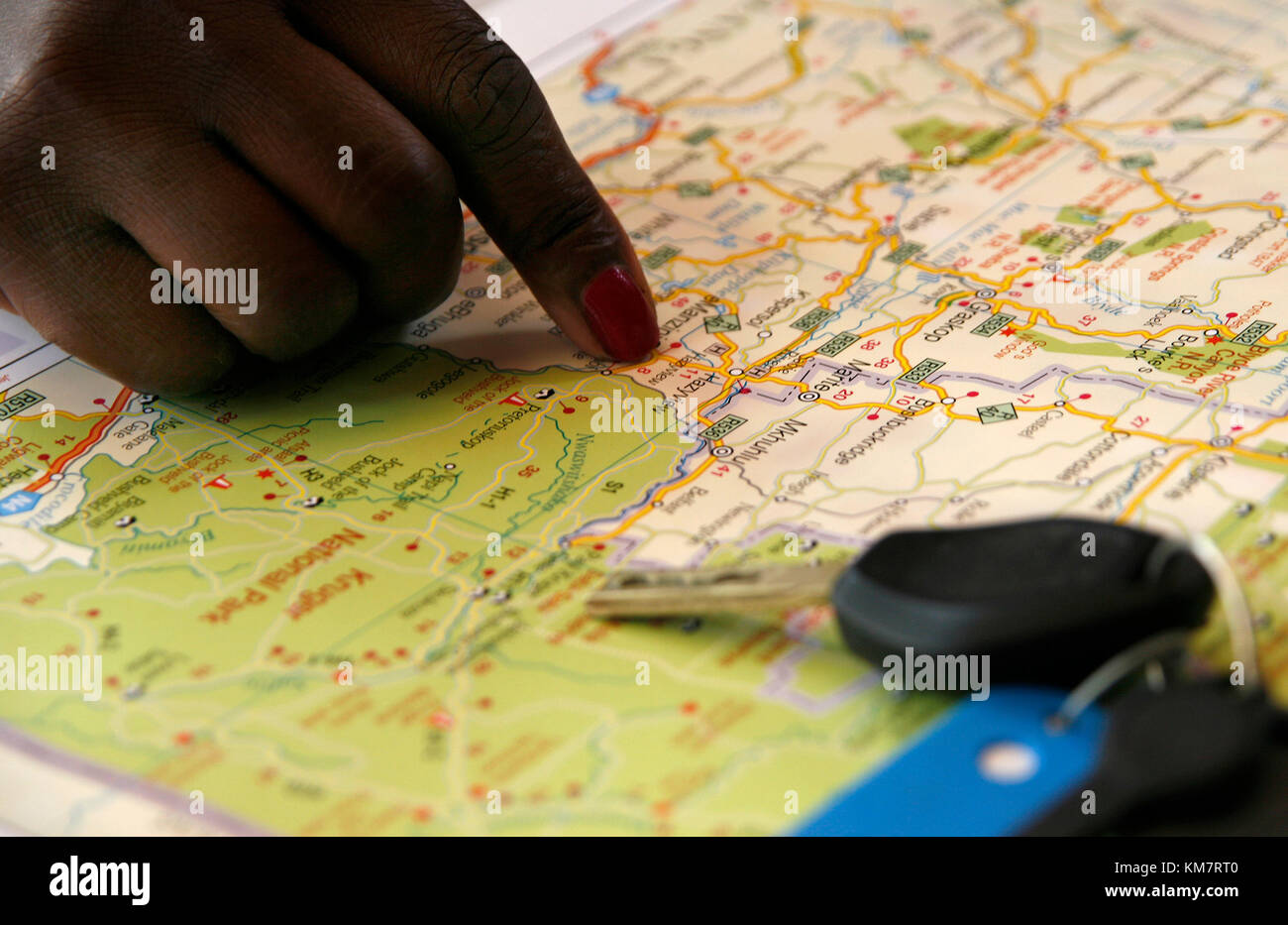 African woman searching on a map Stock Photo - Alamy