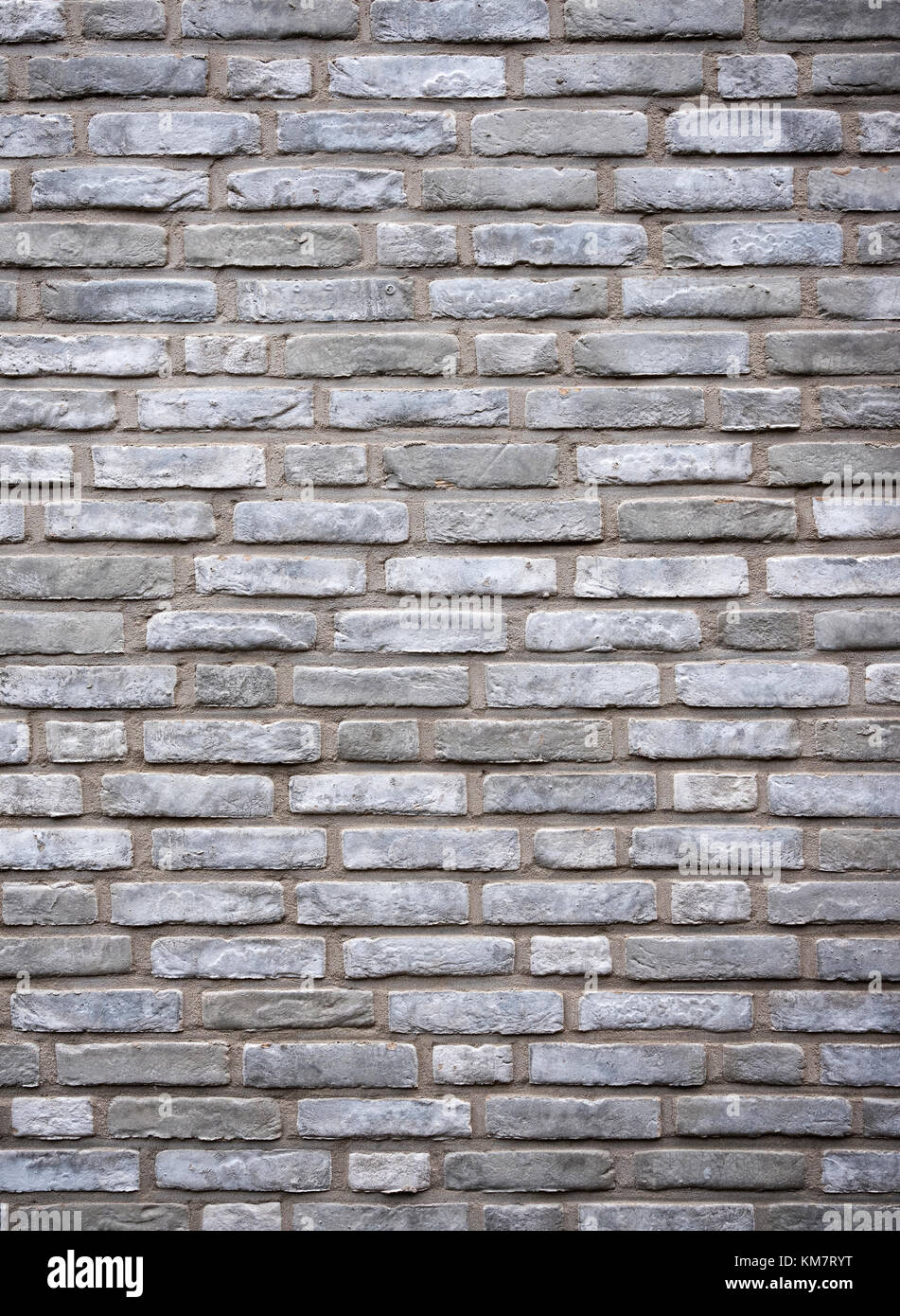 part of wall consisting of grey silver bricks Stock Photo - Alamy