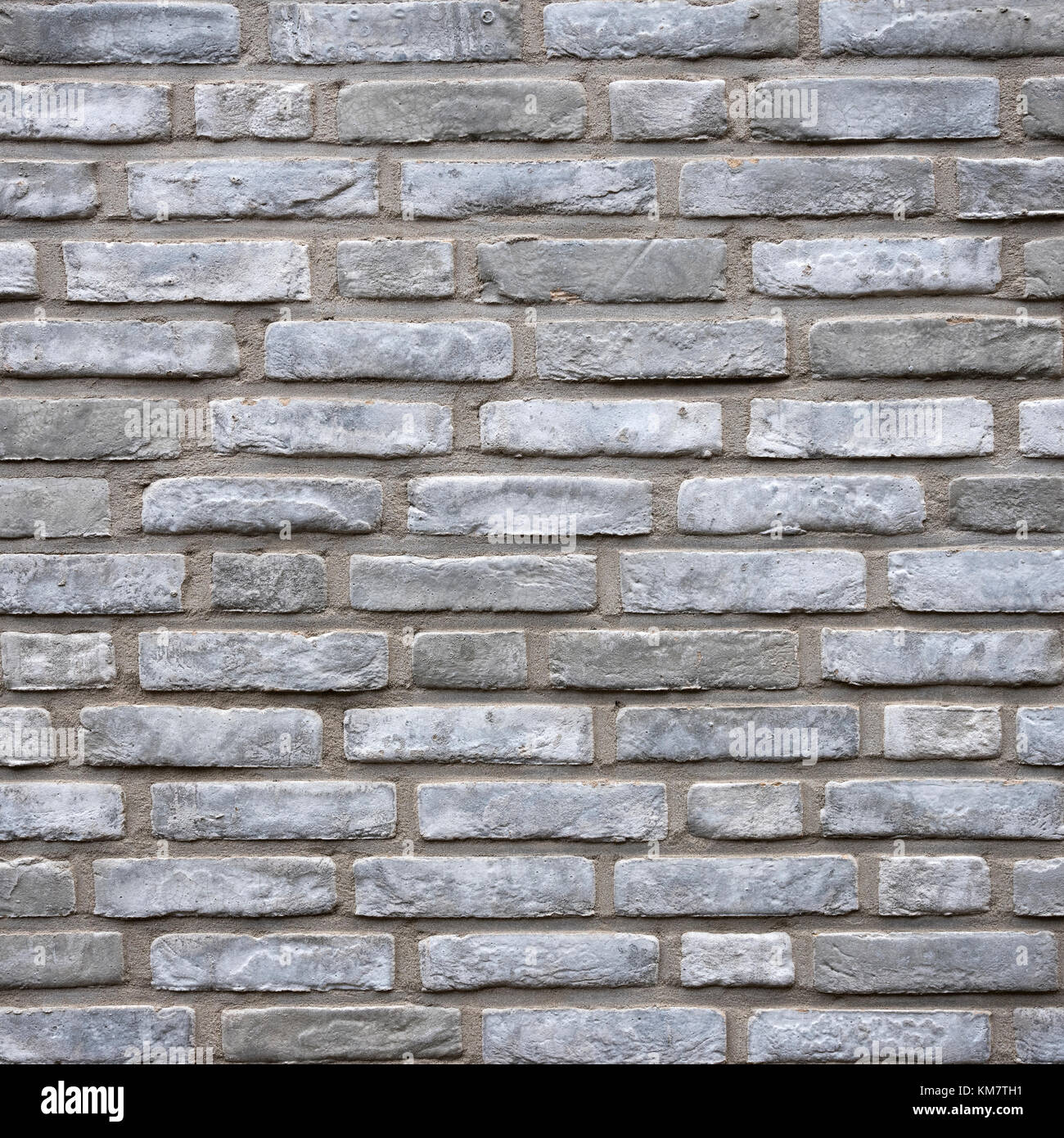 part of wall consisting of grey silver bricks Stock Photo - Alamy