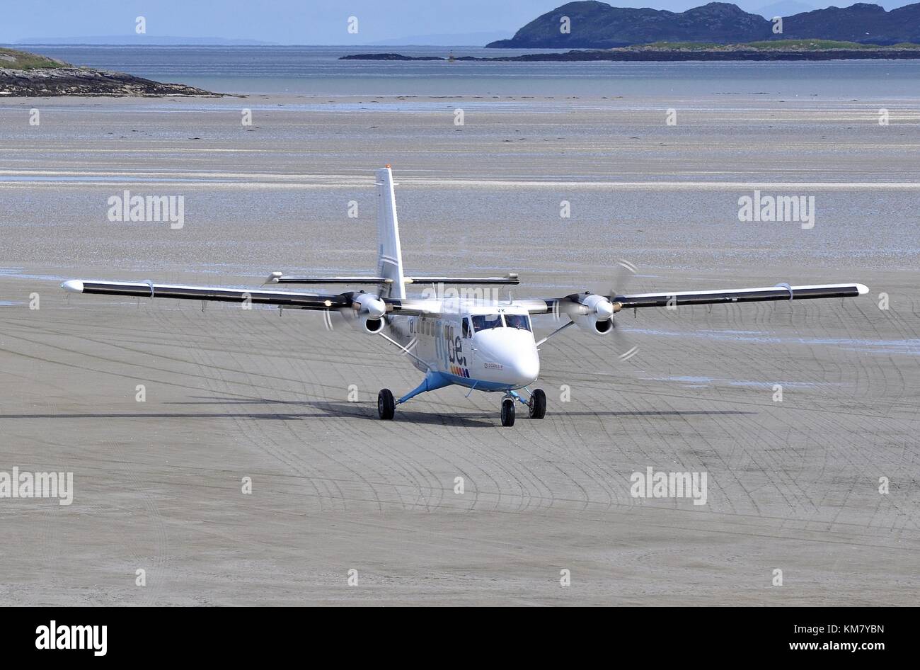 BEACH RUNWAY ON THE ISLAND OF BARRA, OUTER HEBRIDES. G-BVVK DHC-6-300 ...