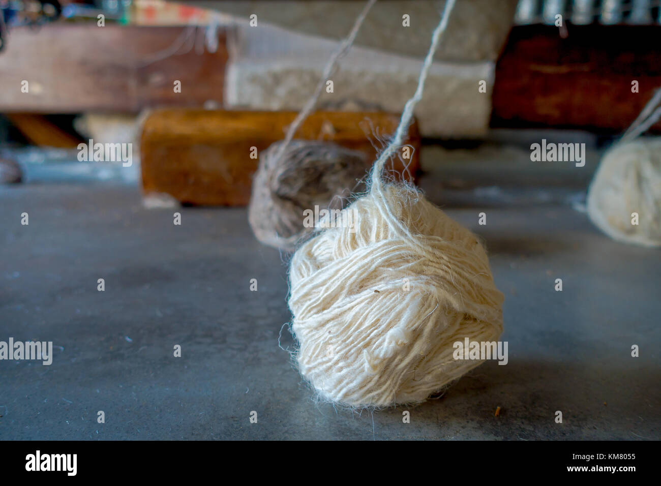 Close up of a whool to work on loom manufacturing whool shawl clothing ...