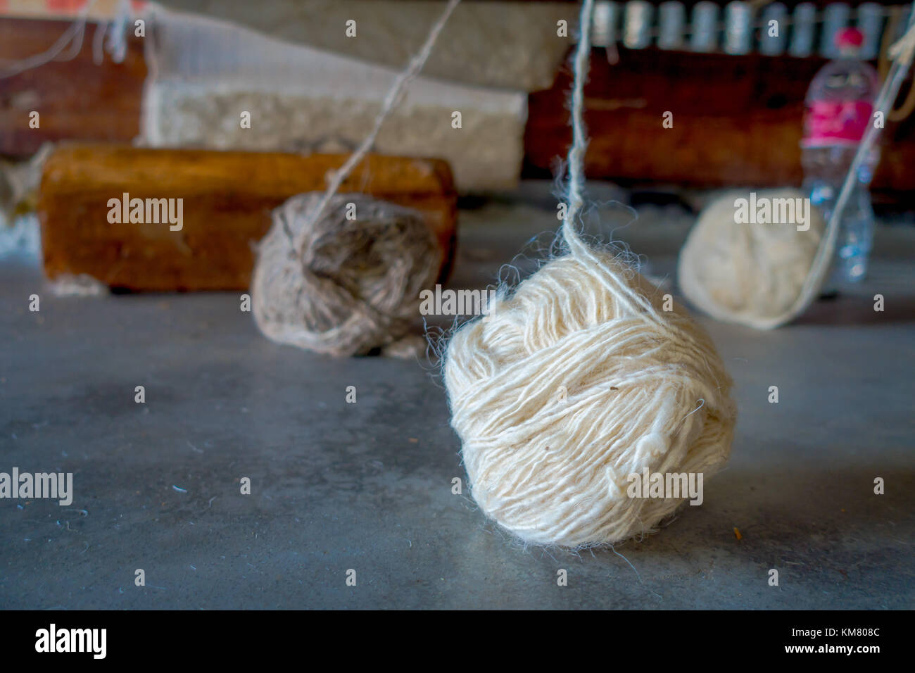 Close up of a whool to work on loom manufacturing whool shawl clothing ...