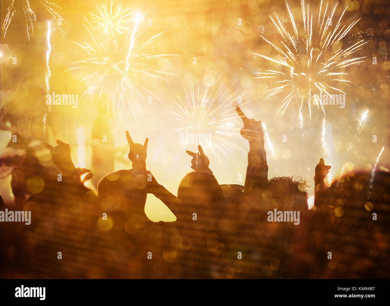 new Year concept - cheering crowd and fireworks Stock Photo - Alamy