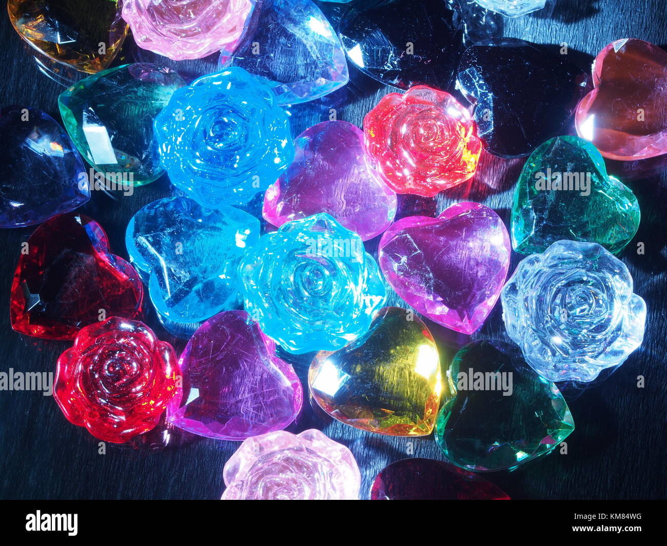 Transparent colored decorative pebbles scattered on the surface. The ...