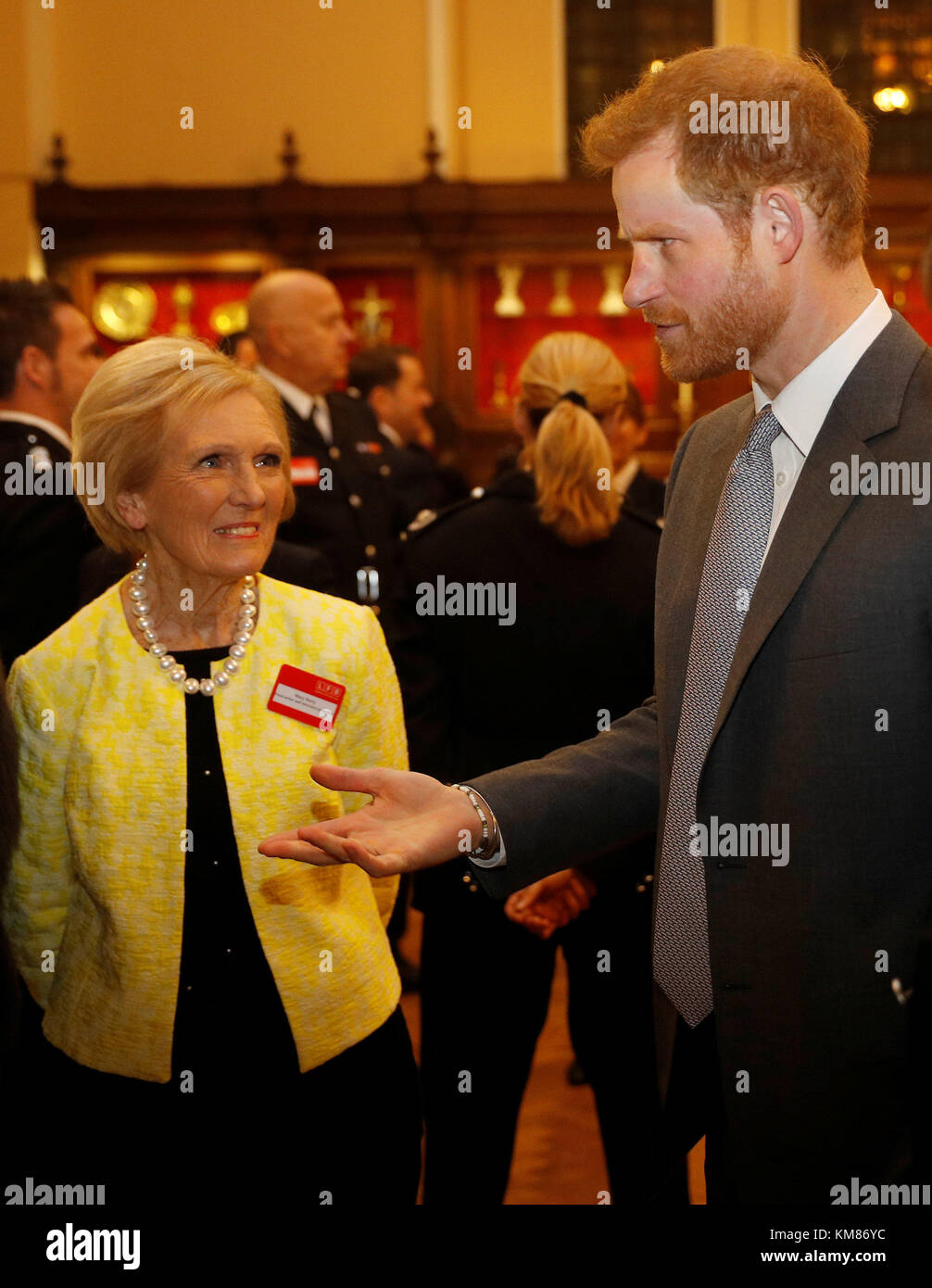 Prince Harry speaks to Mary Berry after the London Fire Brigade Carol ...