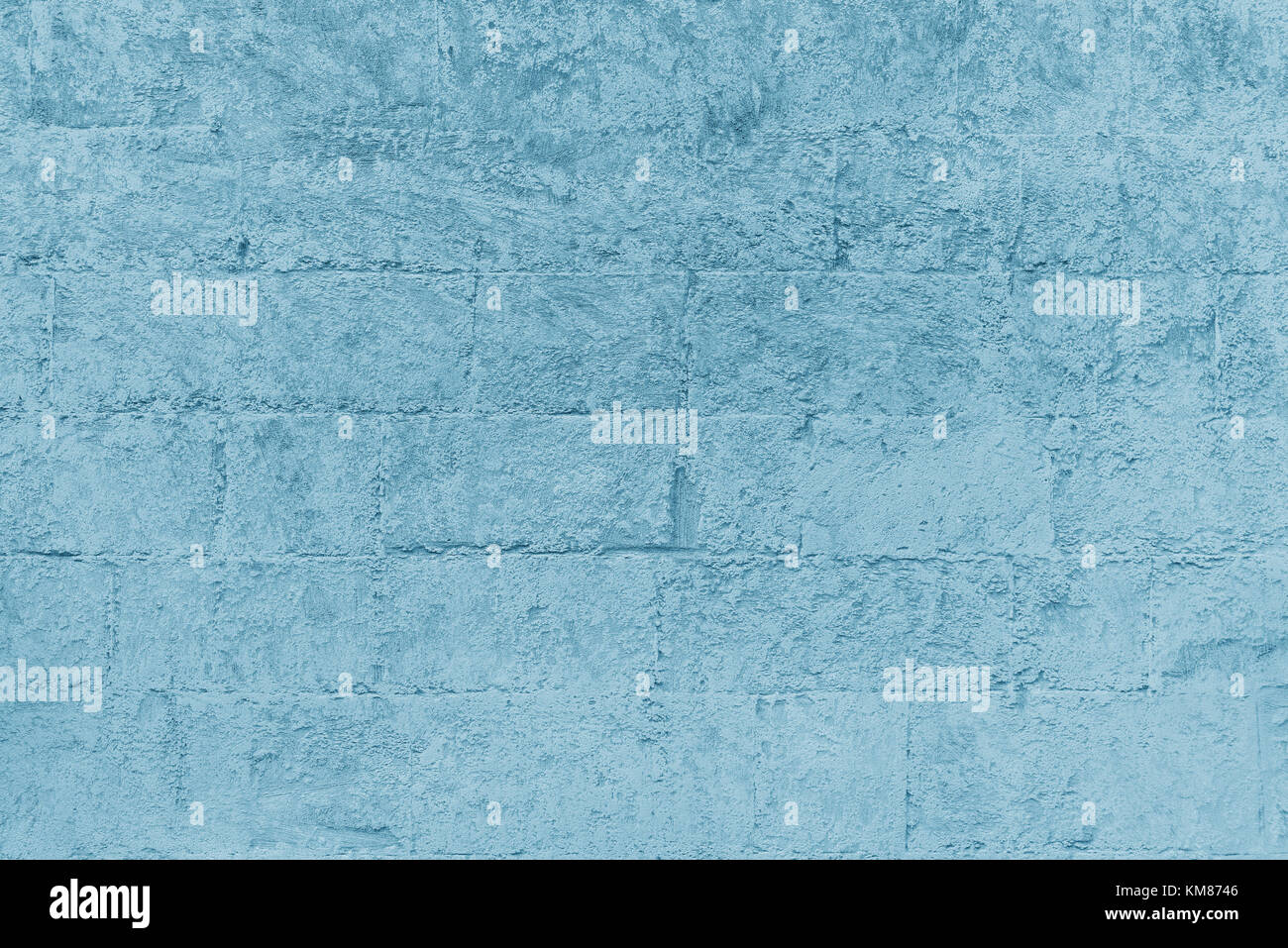Plastered brick wall, large bricks, color toning Stock Photo - Alamy