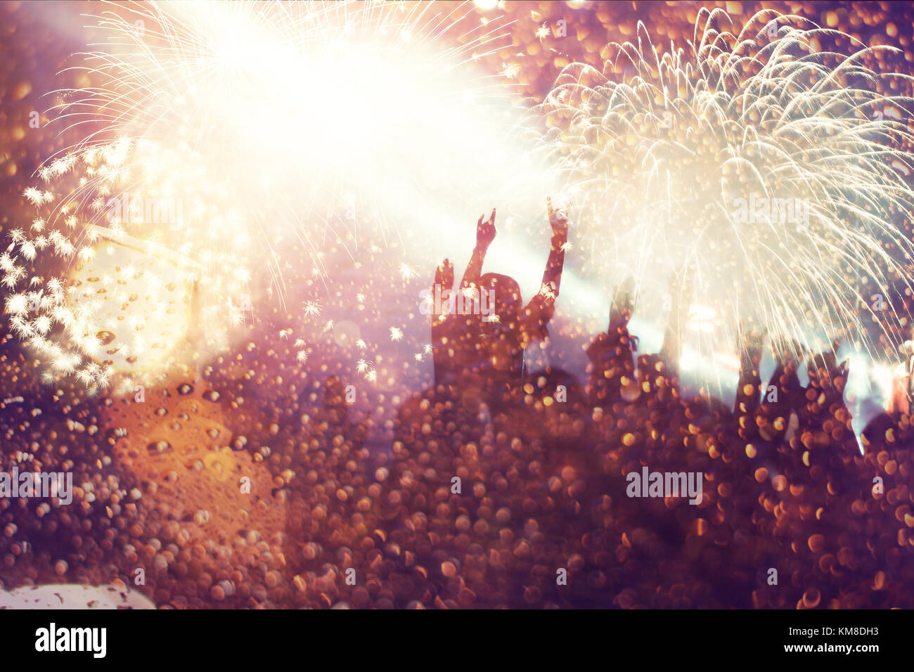 cheering crowd watching fireworks at New Year - holiday celebration ...