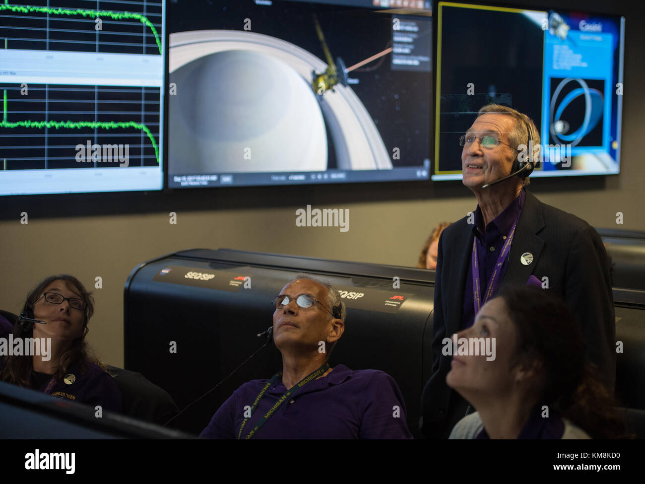 Cassini Program Manager Earl Maize (standing) watches from the mission ...