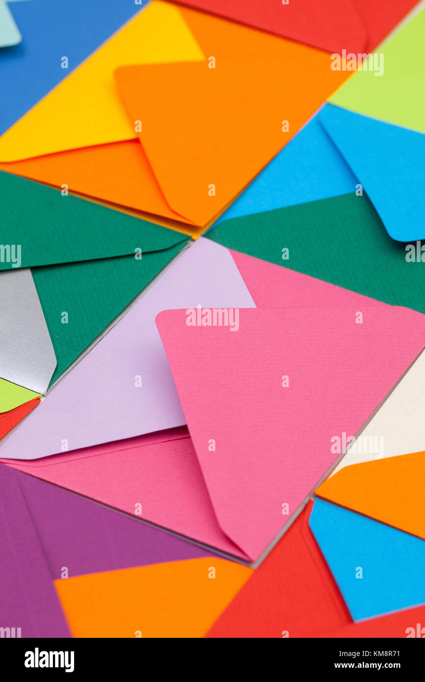 Different colored envelopes on the table Stock Photo - Alamy