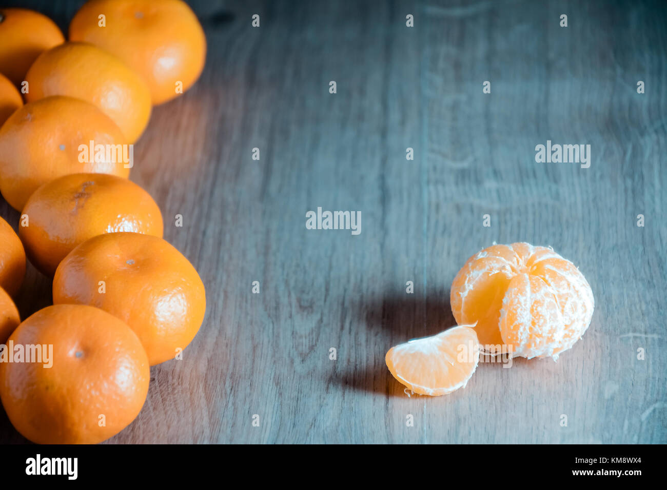 A composition of fresh mandarins on the table in the afternoon Stock ...