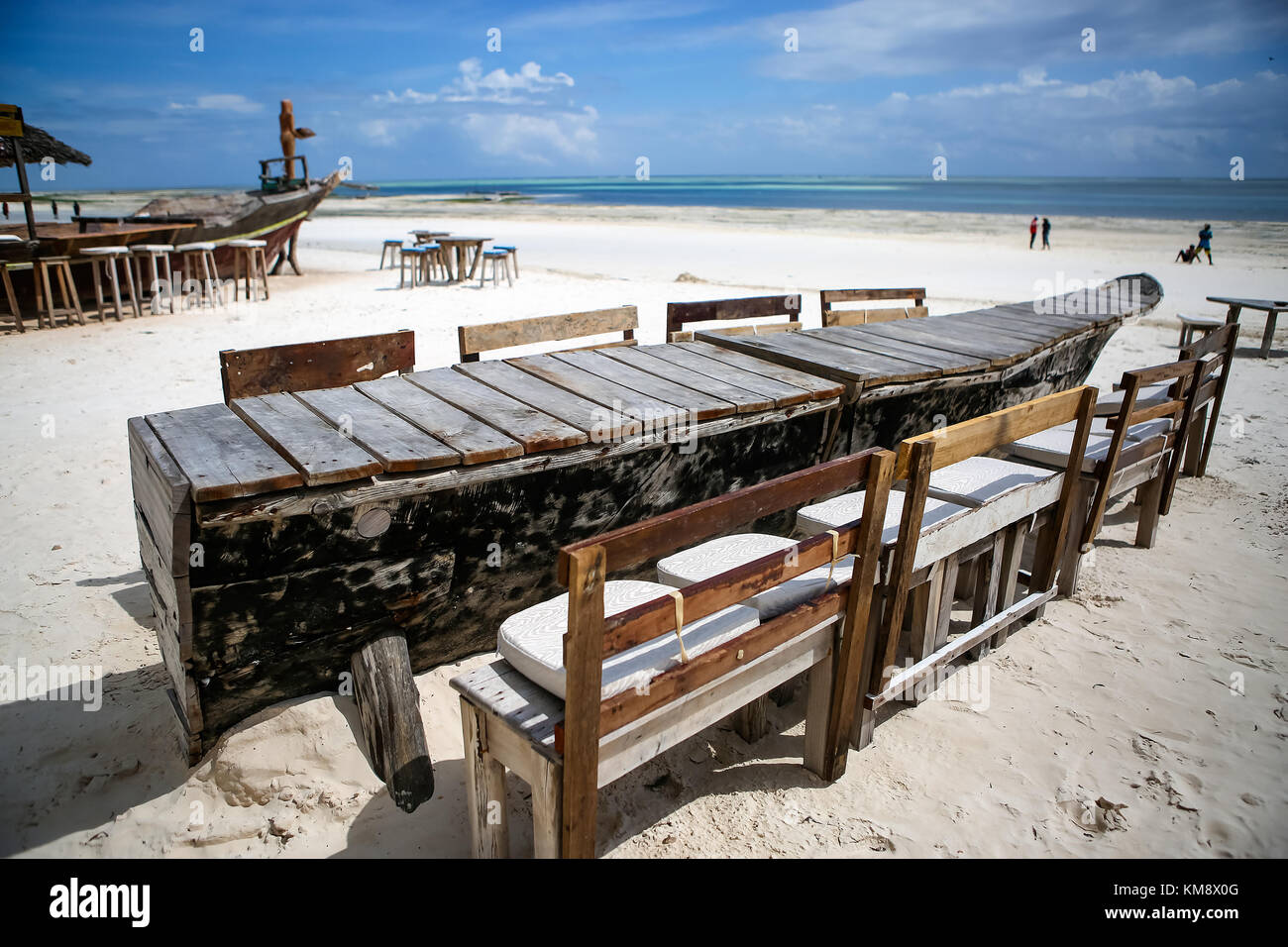 Wooden table and chairs on the beach. Furniture for lounging on Stock ...