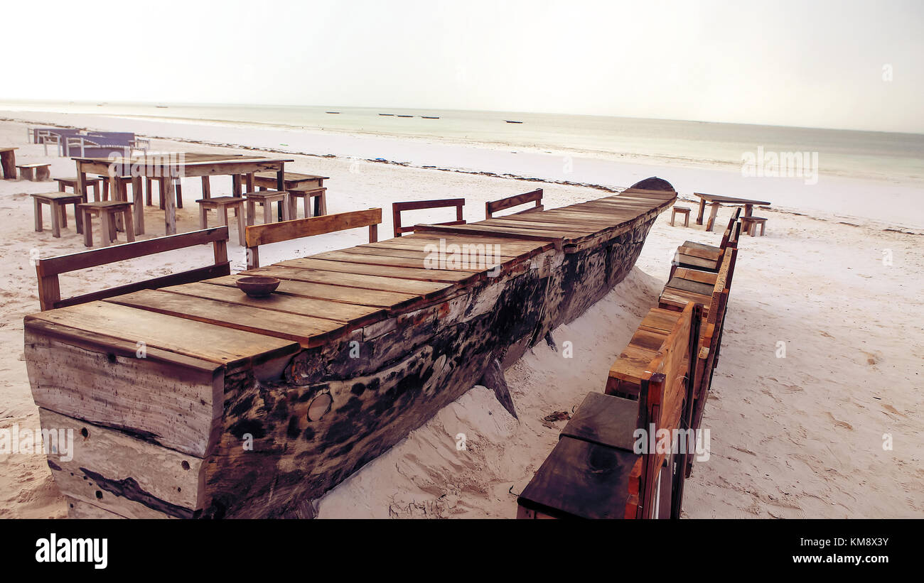 Wooden table and chairs on the beach. Furniture for lounging on Stock ...